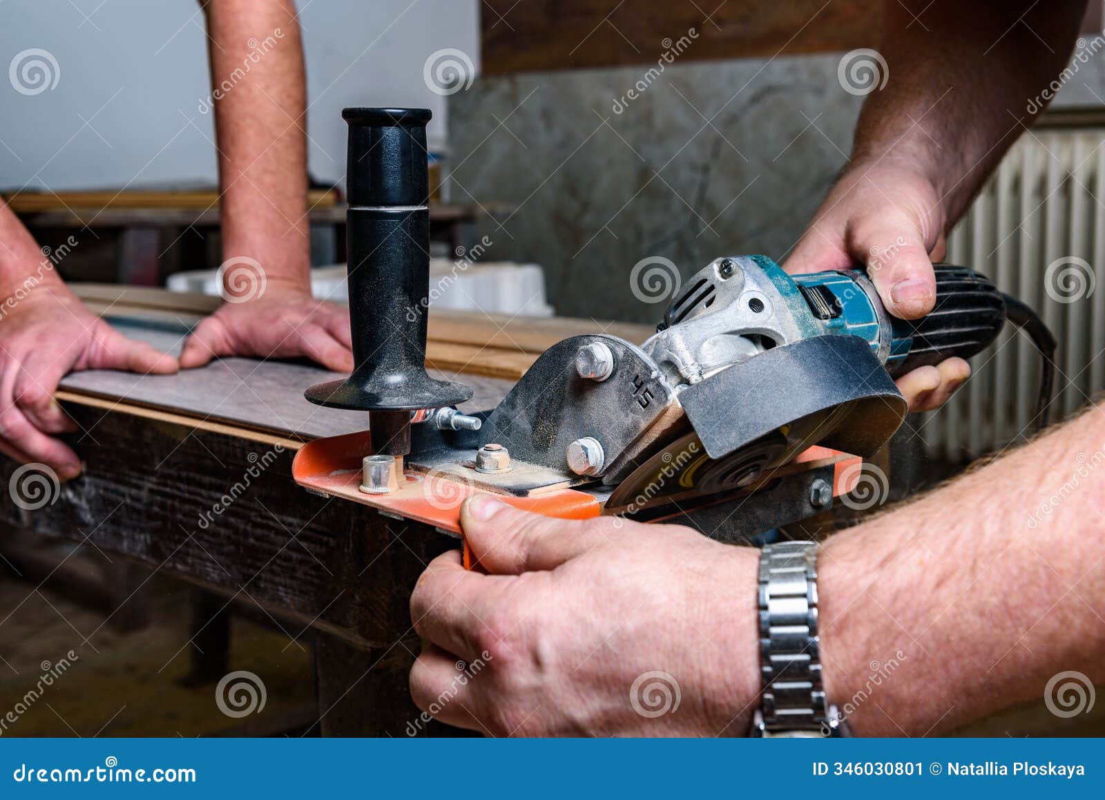 Construction Worker Cutting Laminate Using Angle Grinder with Stand for ...