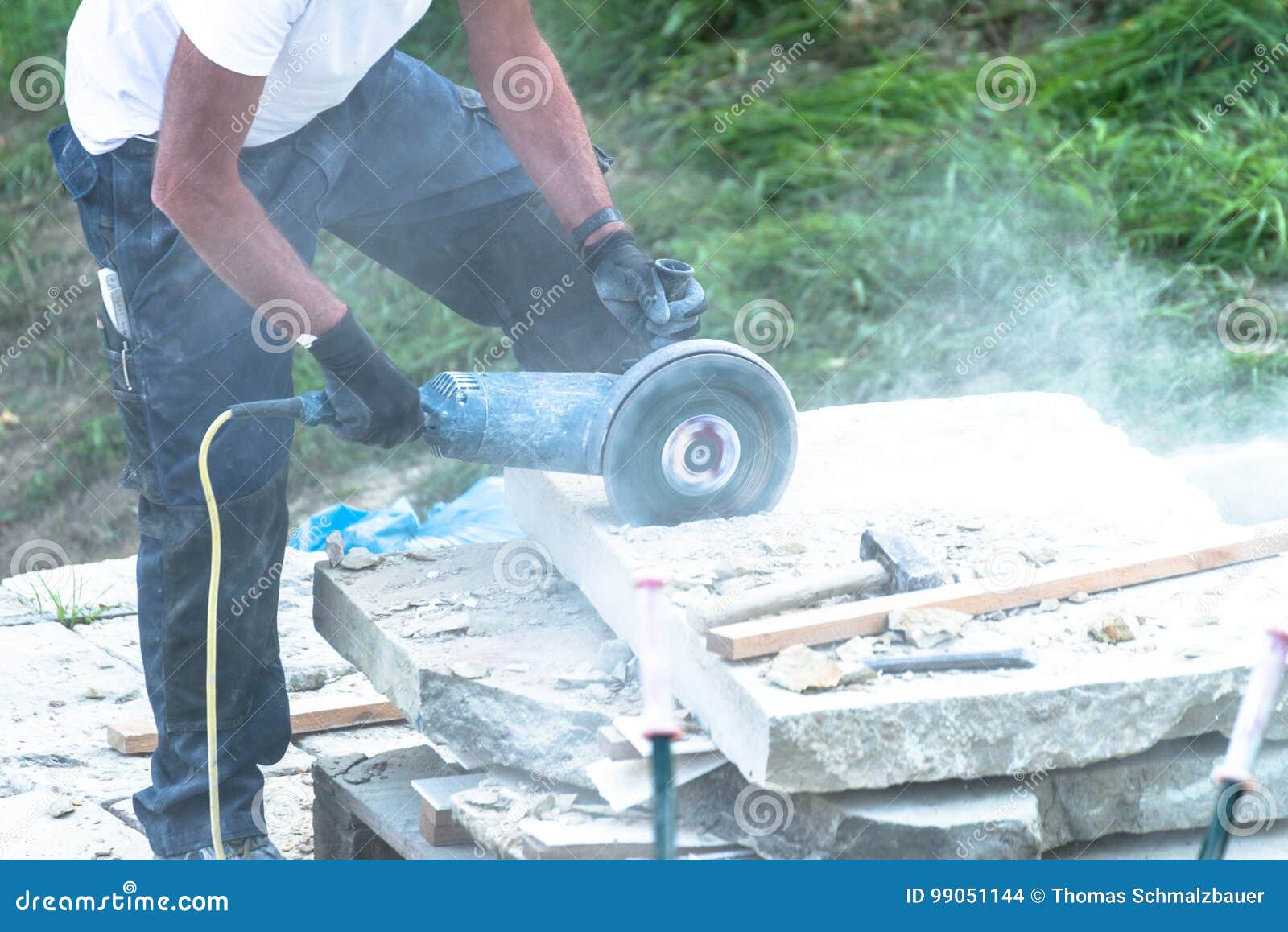 Construction Worker is Cutting a Stone Plate with a Power Cut Stock ...