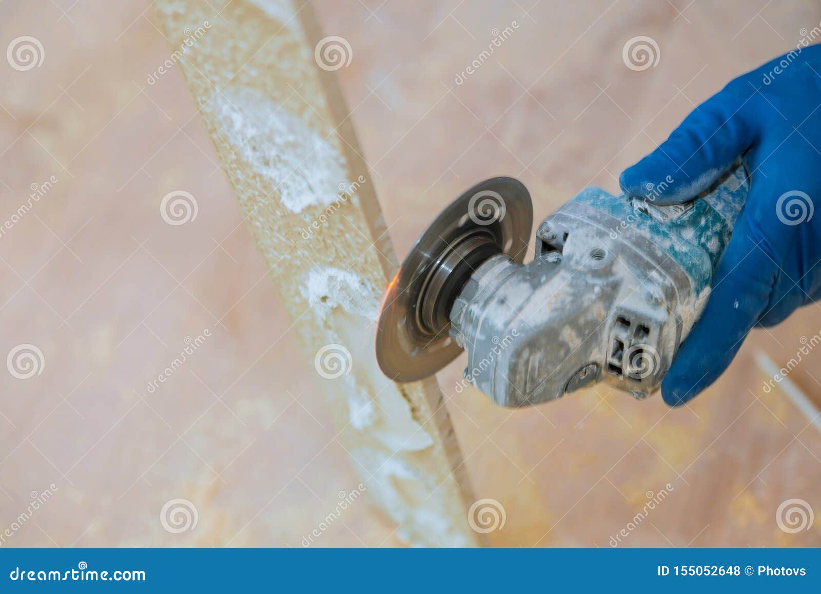 A Construction Worker Cutting a Tile Using Grinder Stock Photo - Image ...