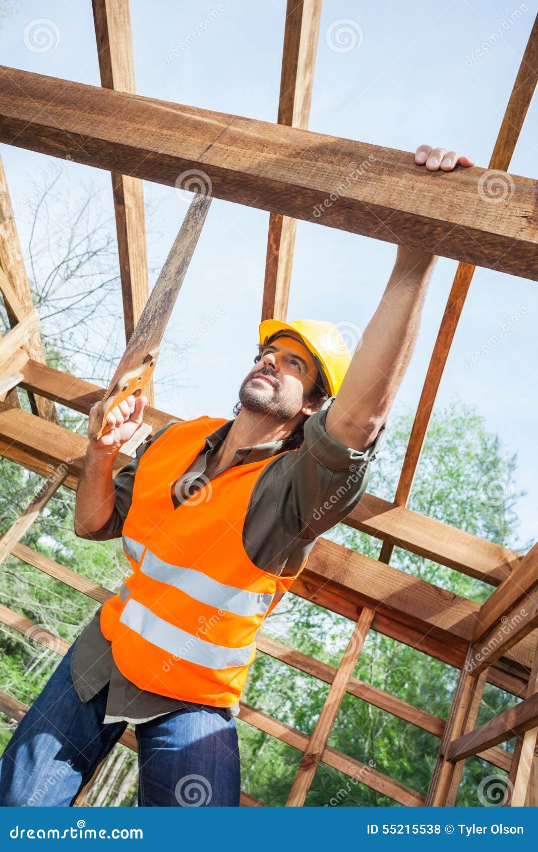 Construction Worker Cutting Wood with Handsaw at Stock Photo - Image of ...