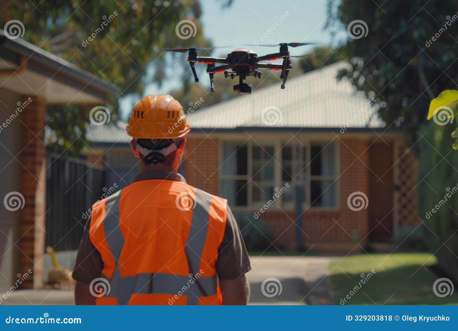Construction Worker Controls Flying Drone in Residential Area. the ...