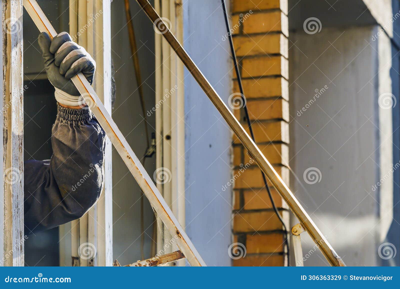 Construction Worker Dismantling Old Wooden Window for Replacement Stock ...
