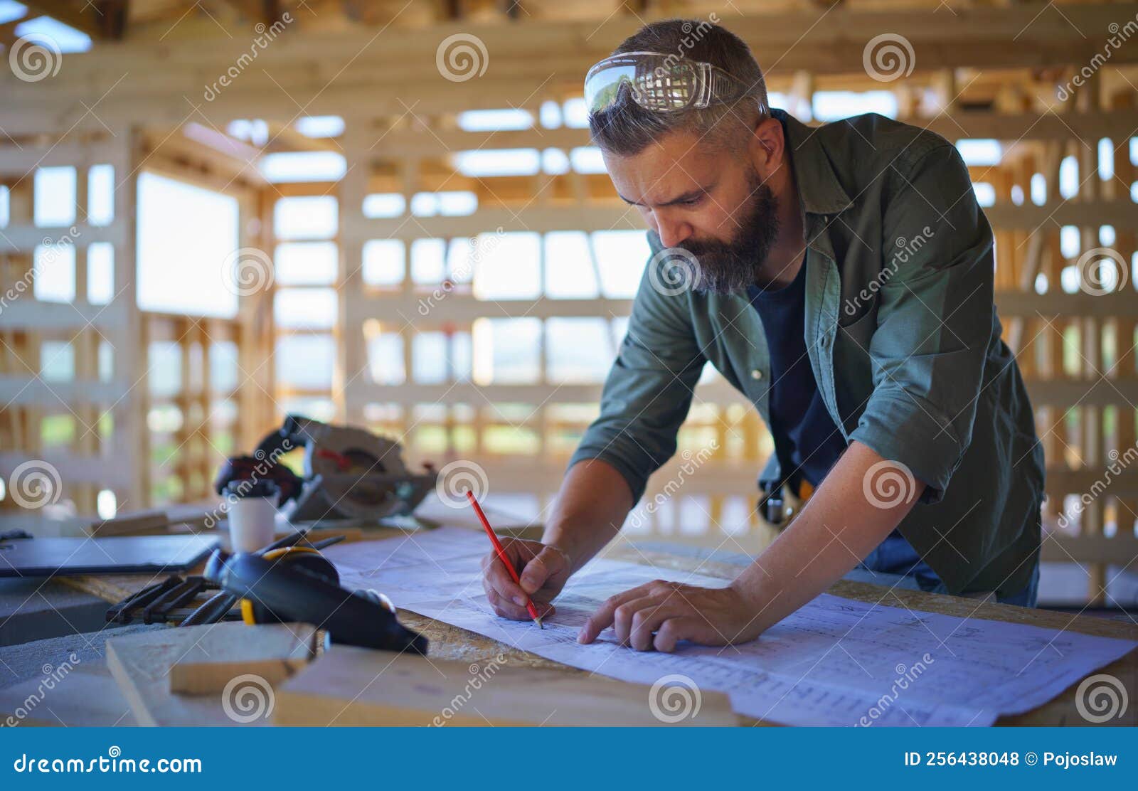 Construction Worker Drawing and Checking Blueprints, Diy Eco-friendly ...