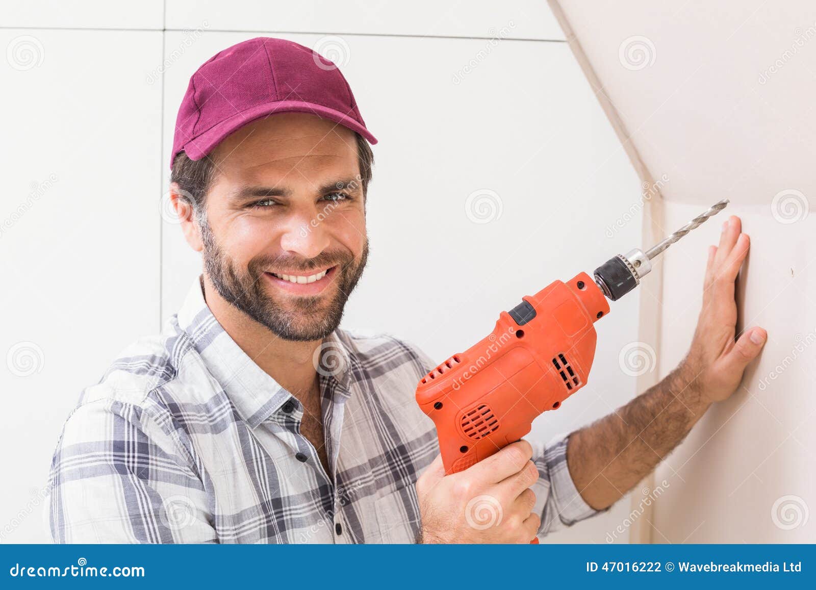 Construction Worker Drilling Hole in Wall Stock Photo - Image of ...