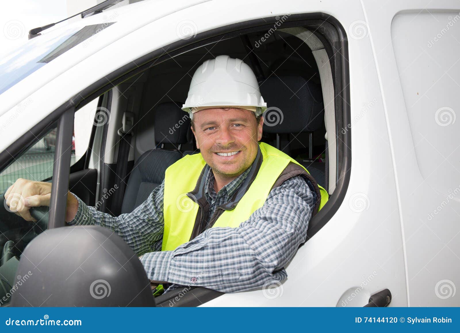 Construction Worker Driving a Car and Talking, Wearing White Helmet ...