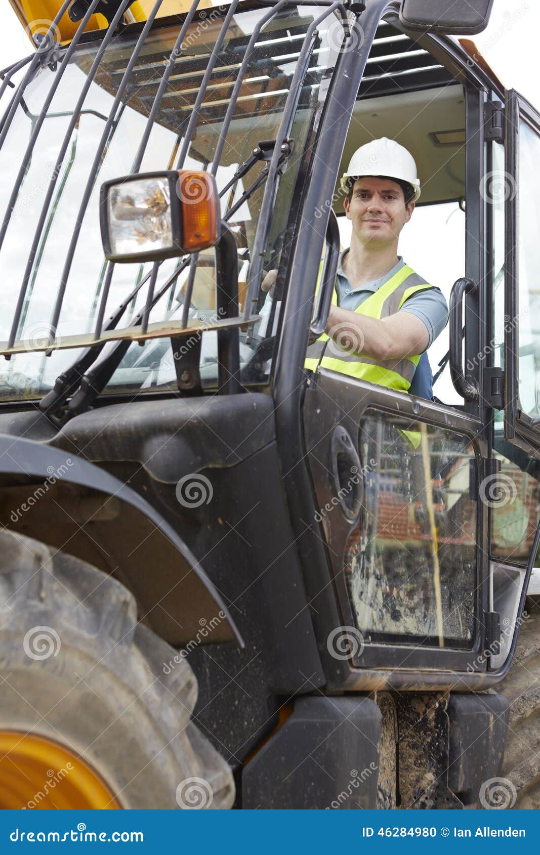 Construction Worker Driving Digger on Building Site Stock Photo - Image ...