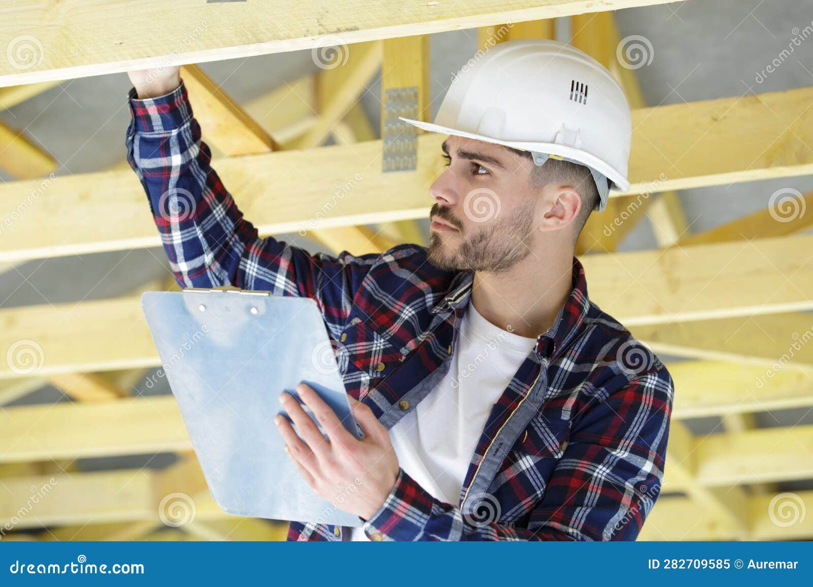 Construction Worker on Duty in Wooden House Frame Stock Image - Image ...
