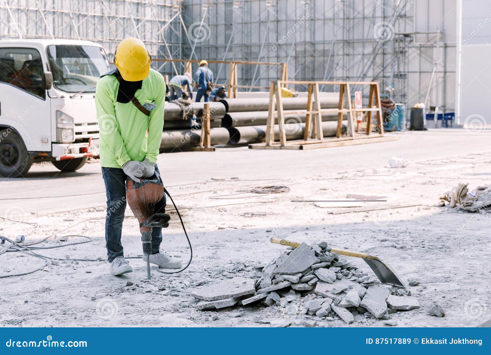 Construction Worker Electric Drill Drilling Concrete Ground in Stock ...