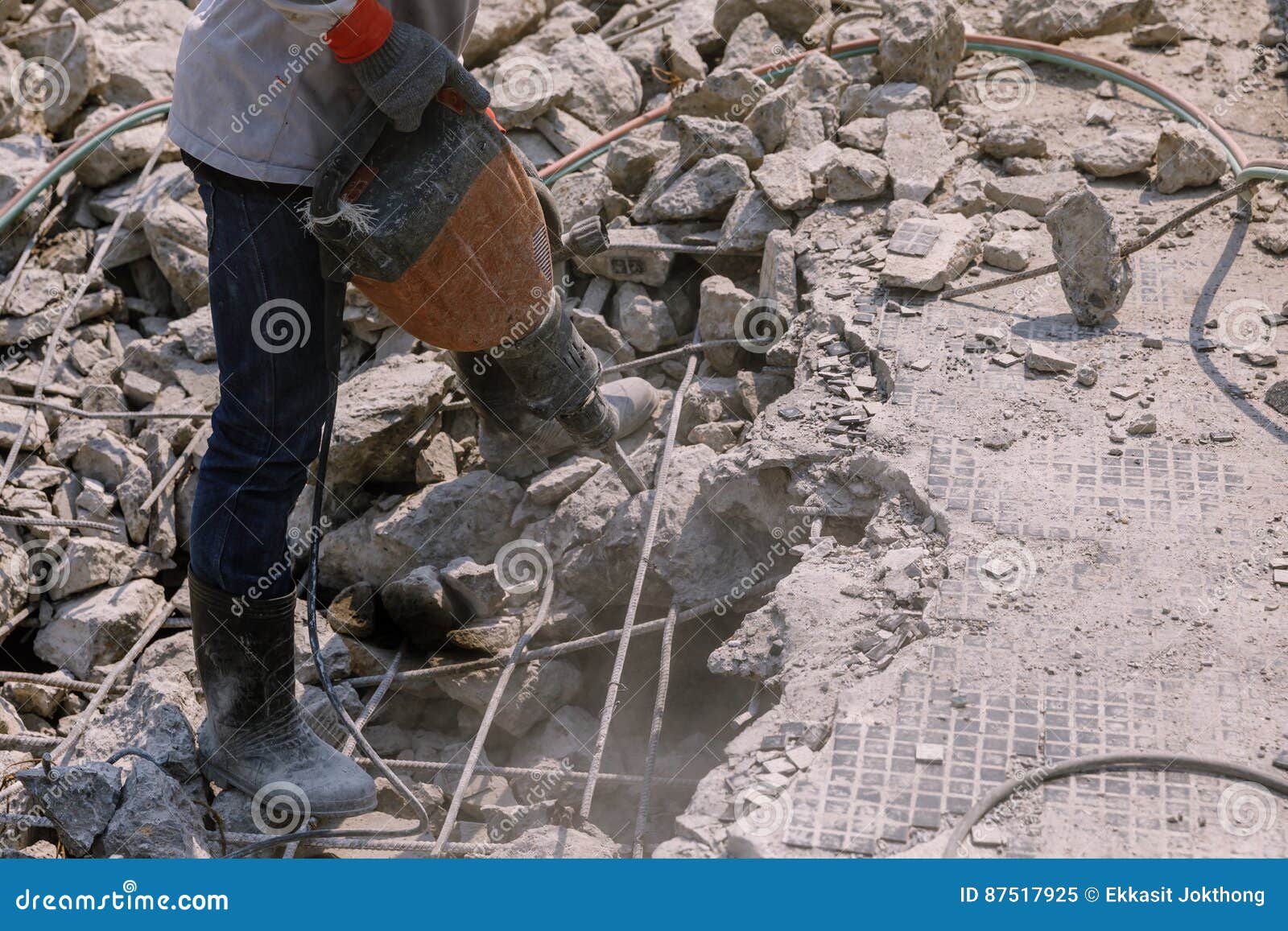 Construction Worker Electric Drill Drilling Concrete Ground in Stock ...