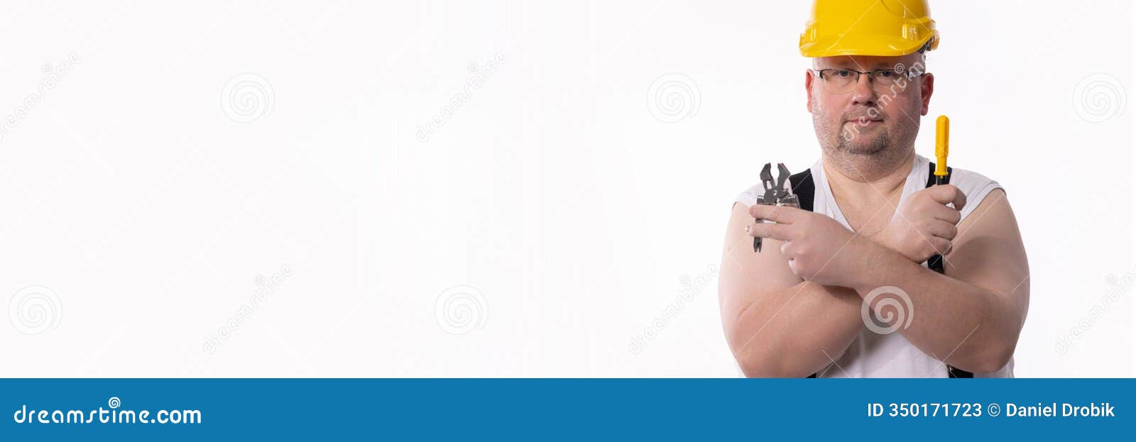 A Construction Worker with Essential Tools and a Safety Helmet for ...