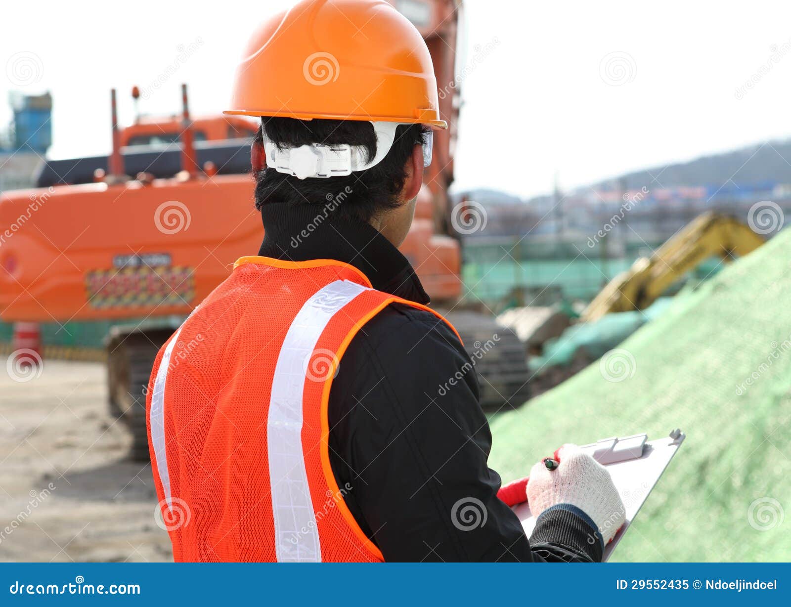 Construction Worker and Excavator on the Background Stock Image - Image ...