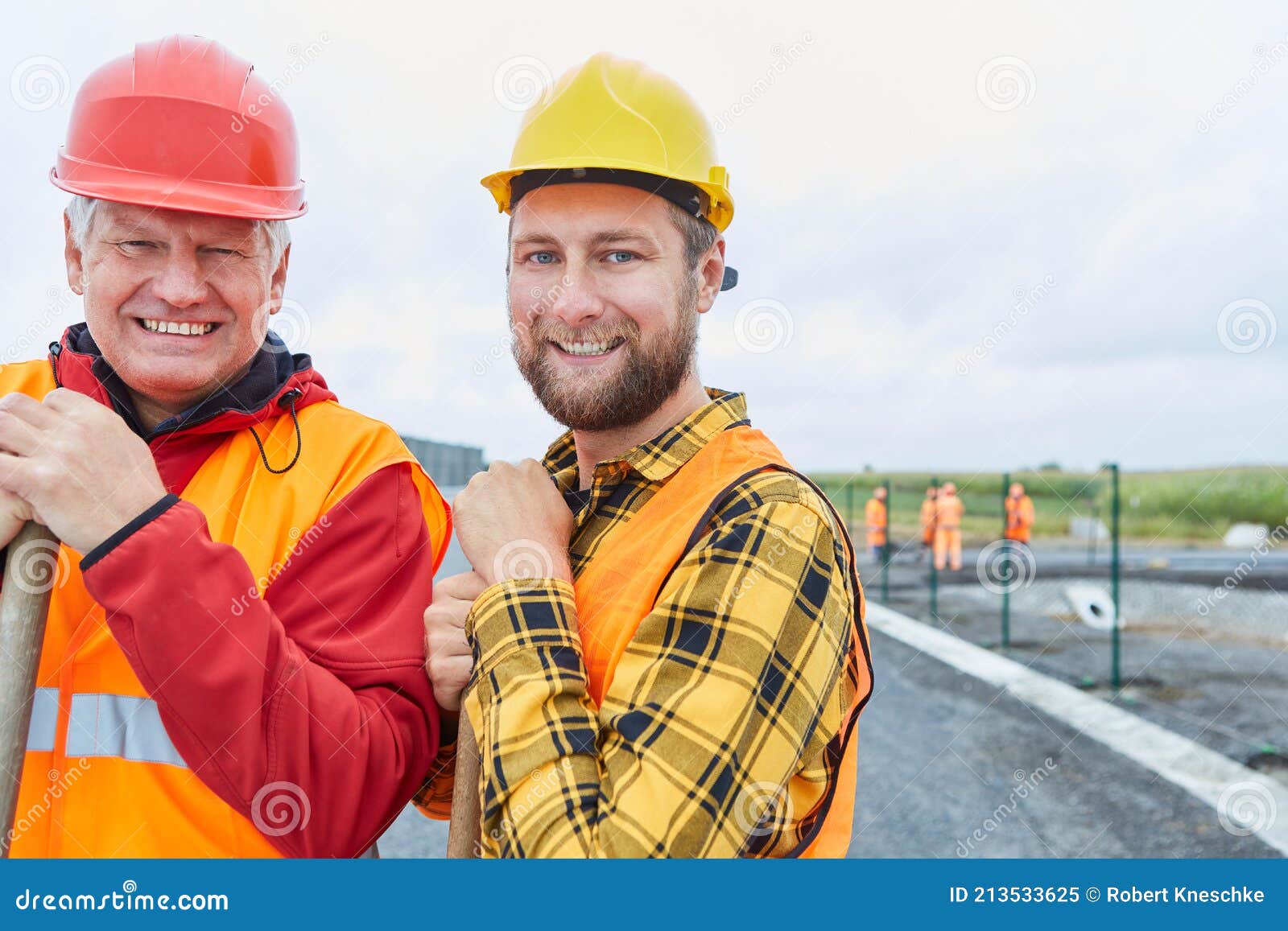 Construction Worker with Experience and a Young Colleague Stock Image ...