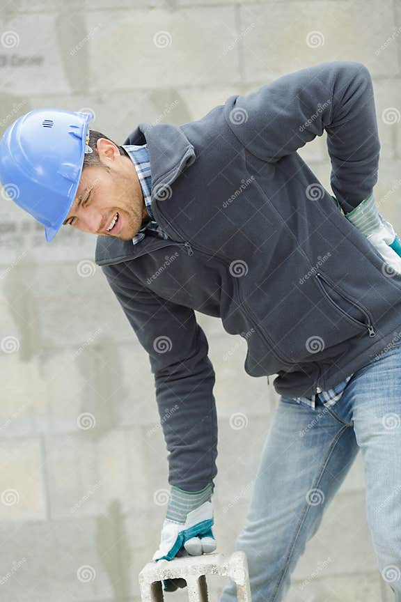 Construction Worker Experiencing Back Pain Stock Image - Image of ...