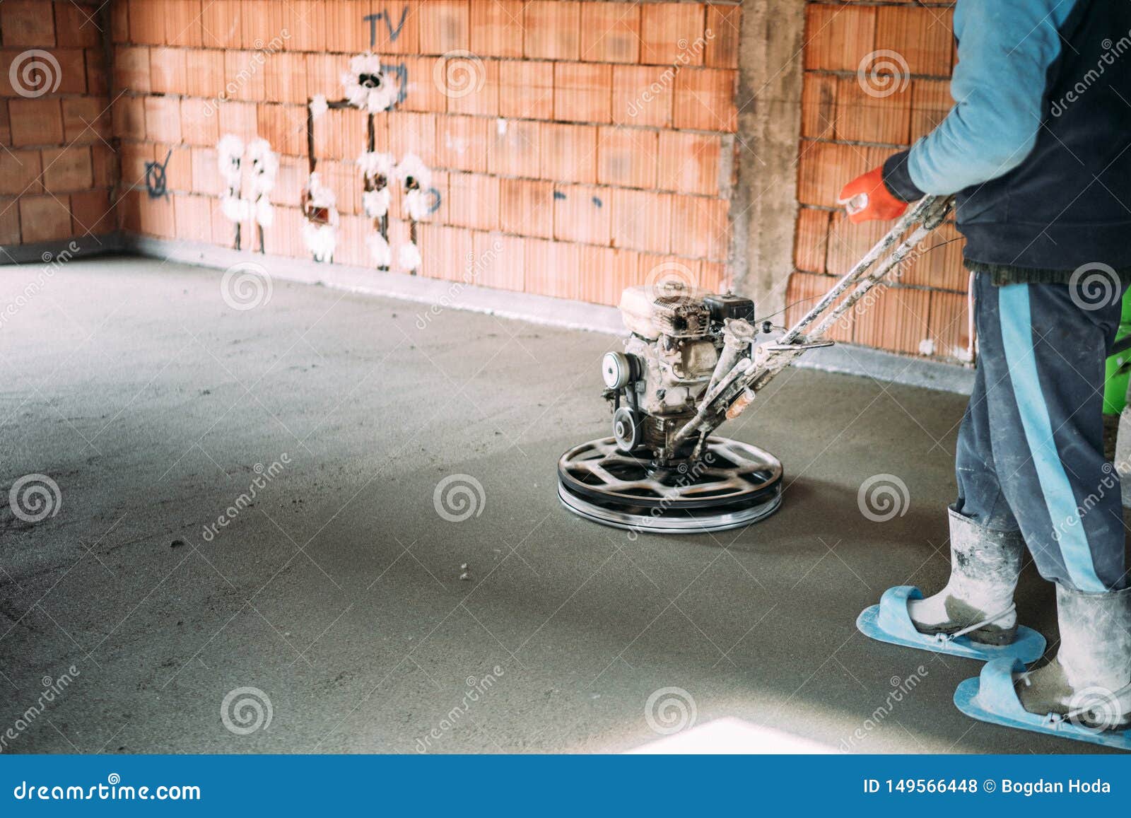 Construction Worker Finishes Concrete Screed with Power Trowel Machine ...