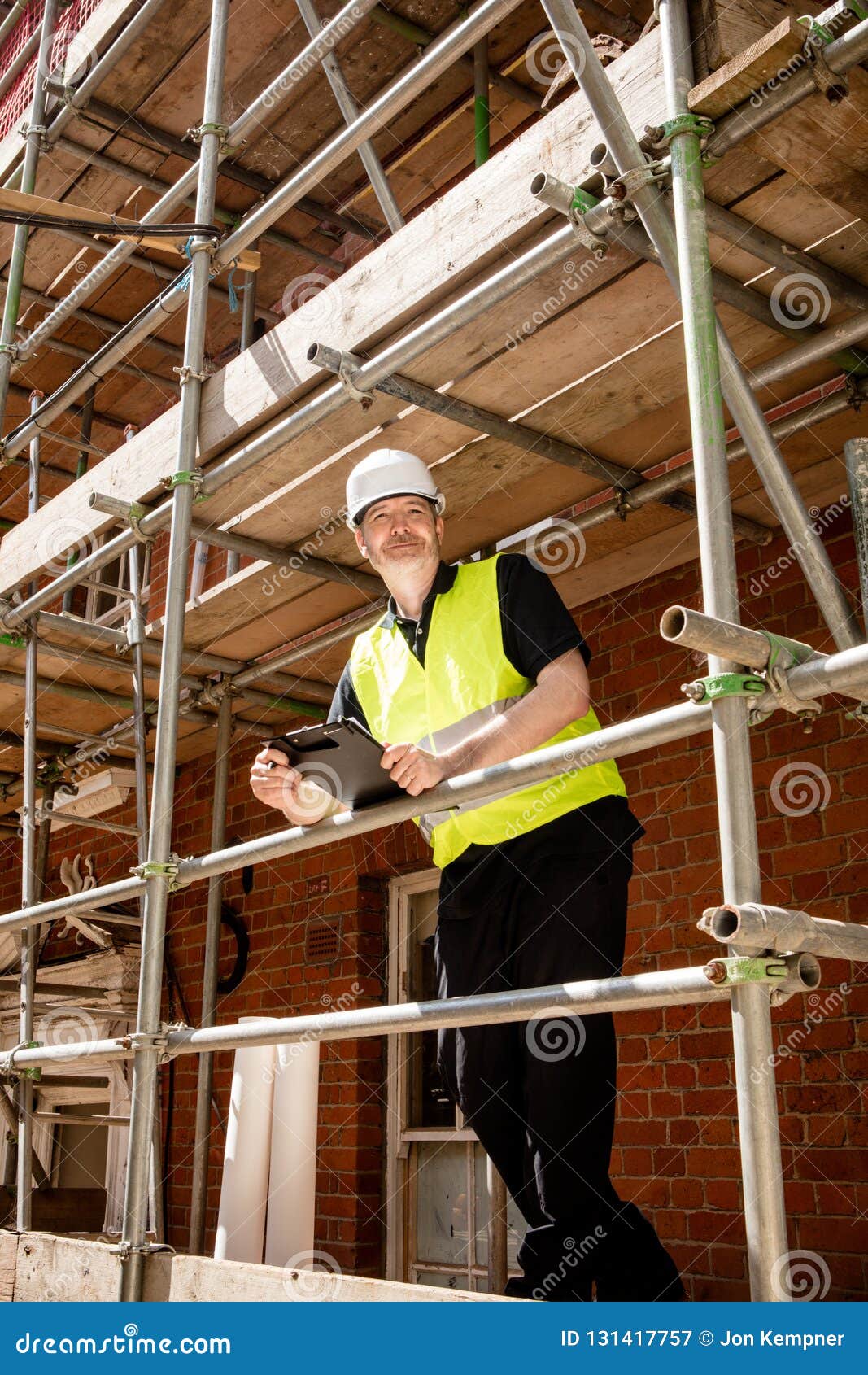 Construction Worker, Foreman or Architect on Scaffolding at ...