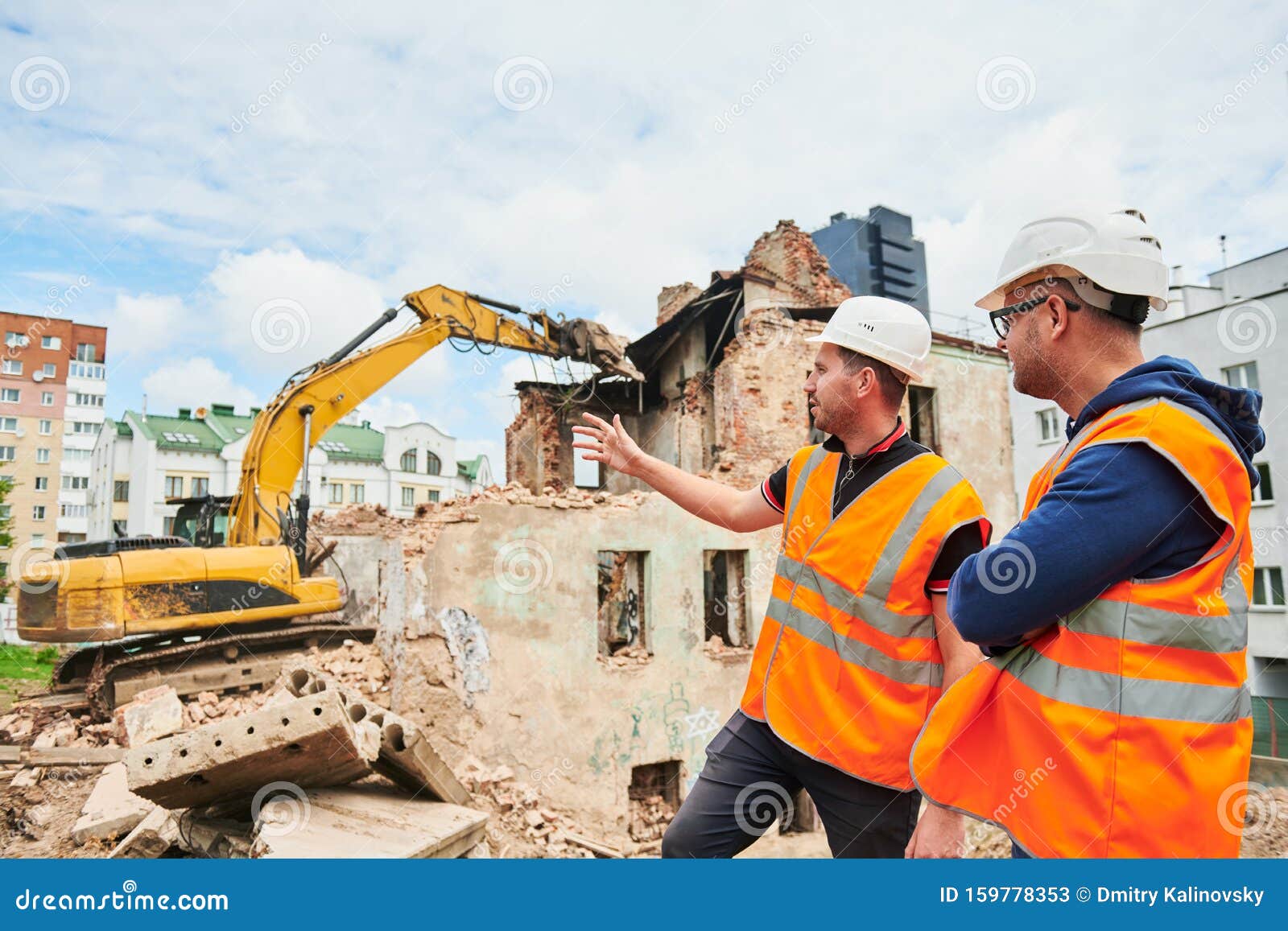 Construction Worker and Foreman Discussing at Building Site. Stock ...