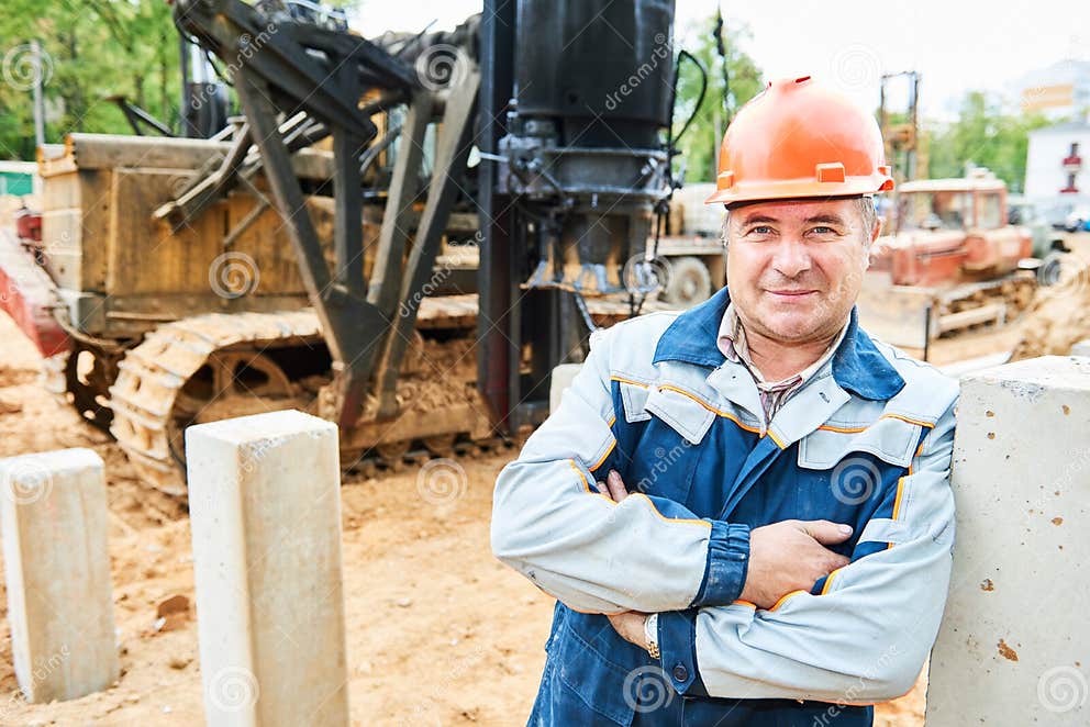 Construction Worker in Front of Pile Driver Machine Stock Photo - Image ...
