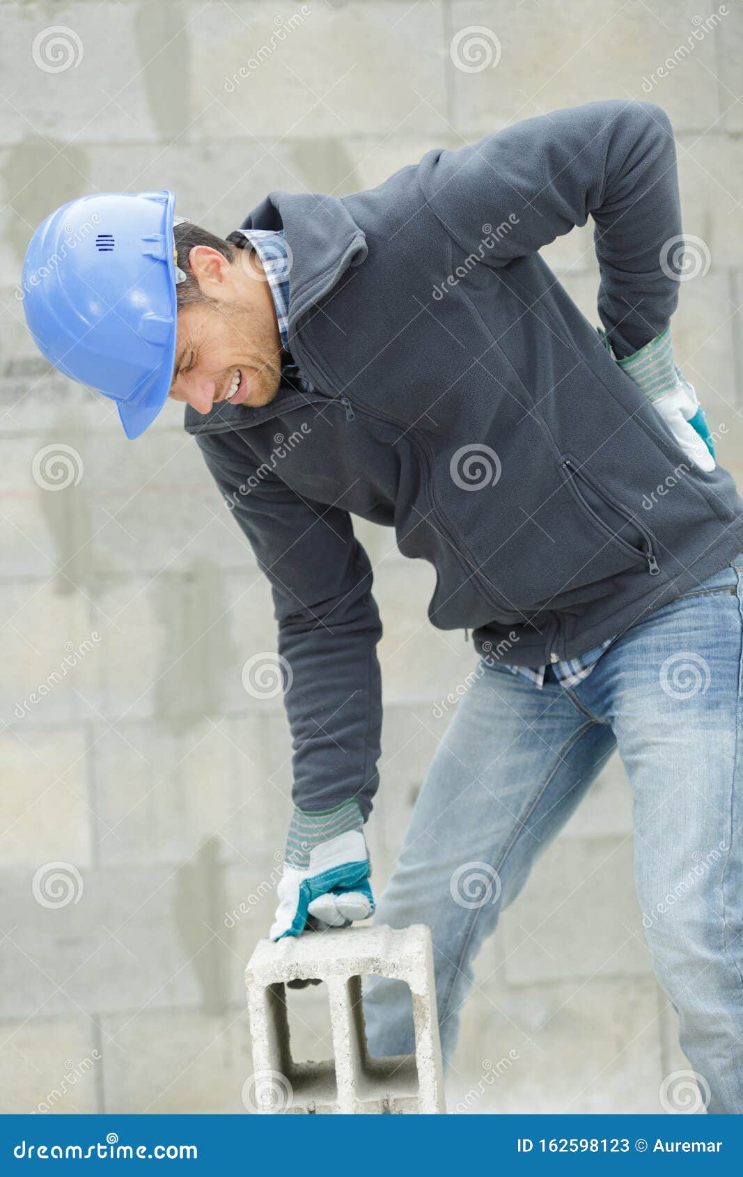 Back Of Worker In A Helmet Against The Backdrop Of Hydroelectric ...