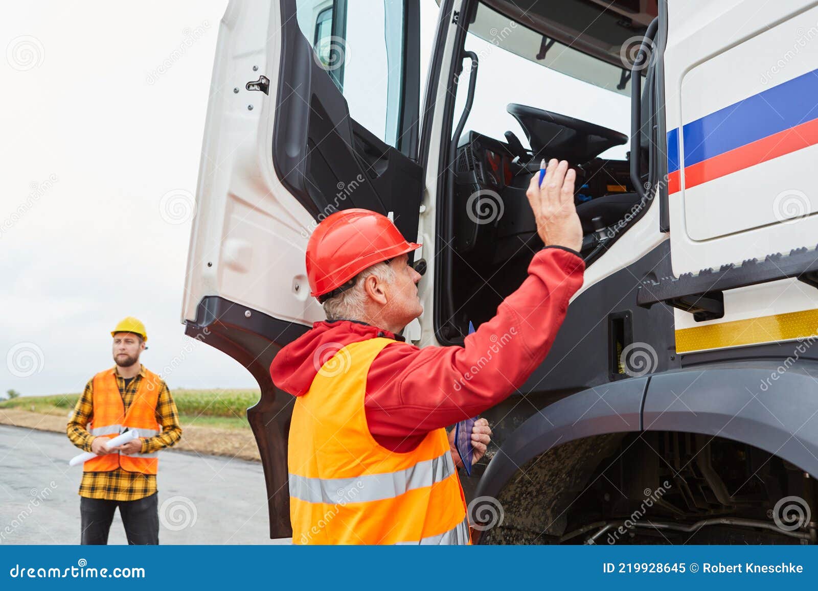 Construction Worker Gives Truck Driver an Instruction Stock Image ...