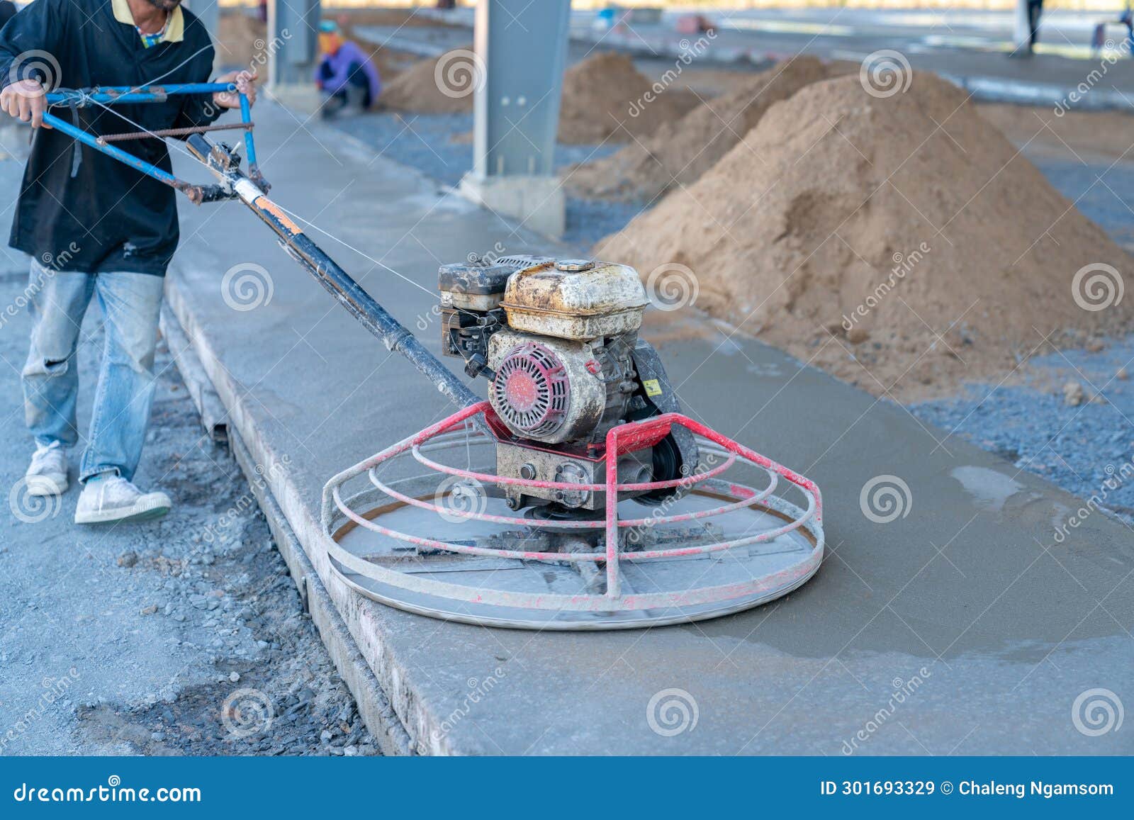 Construction Worker Grind the Concrete Surface after Pour Concrete ...