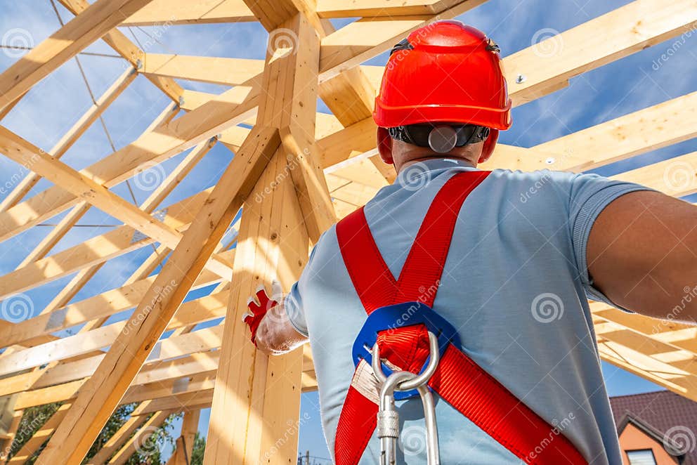 Construction Worker Guiding Framework Assembly at a Building Site Under ...