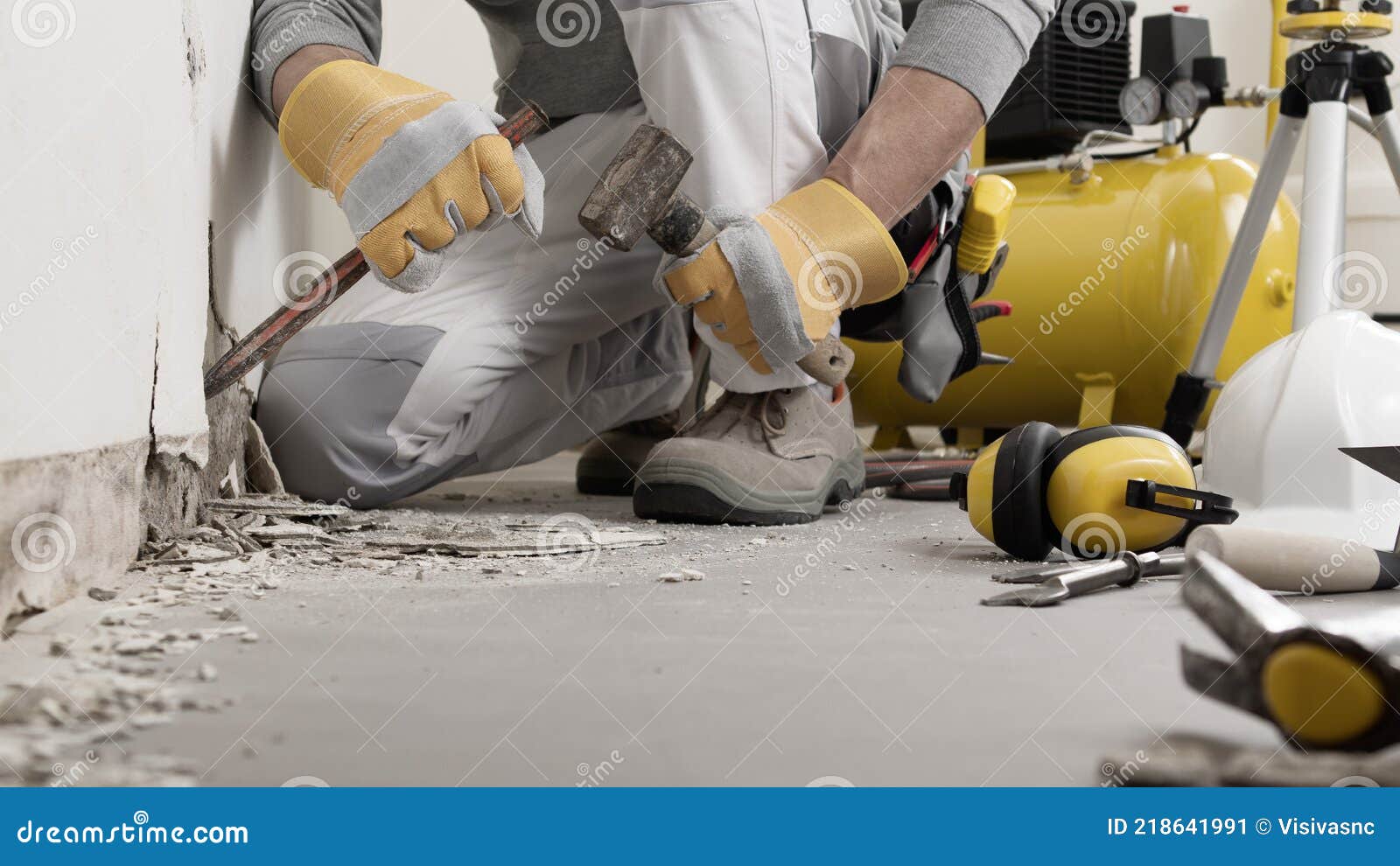 Construction Worker Hands with Gloves Working with Hammer and Chisel To ...