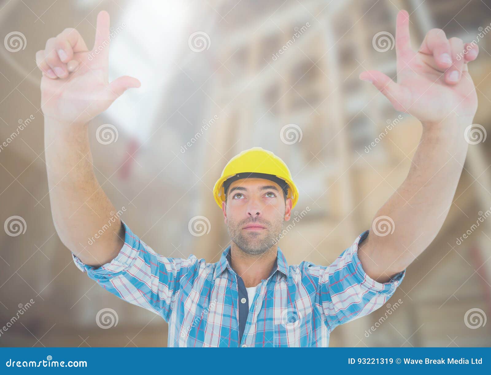 Construction Worker with Hands Up in Air in Front of Construction Site ...