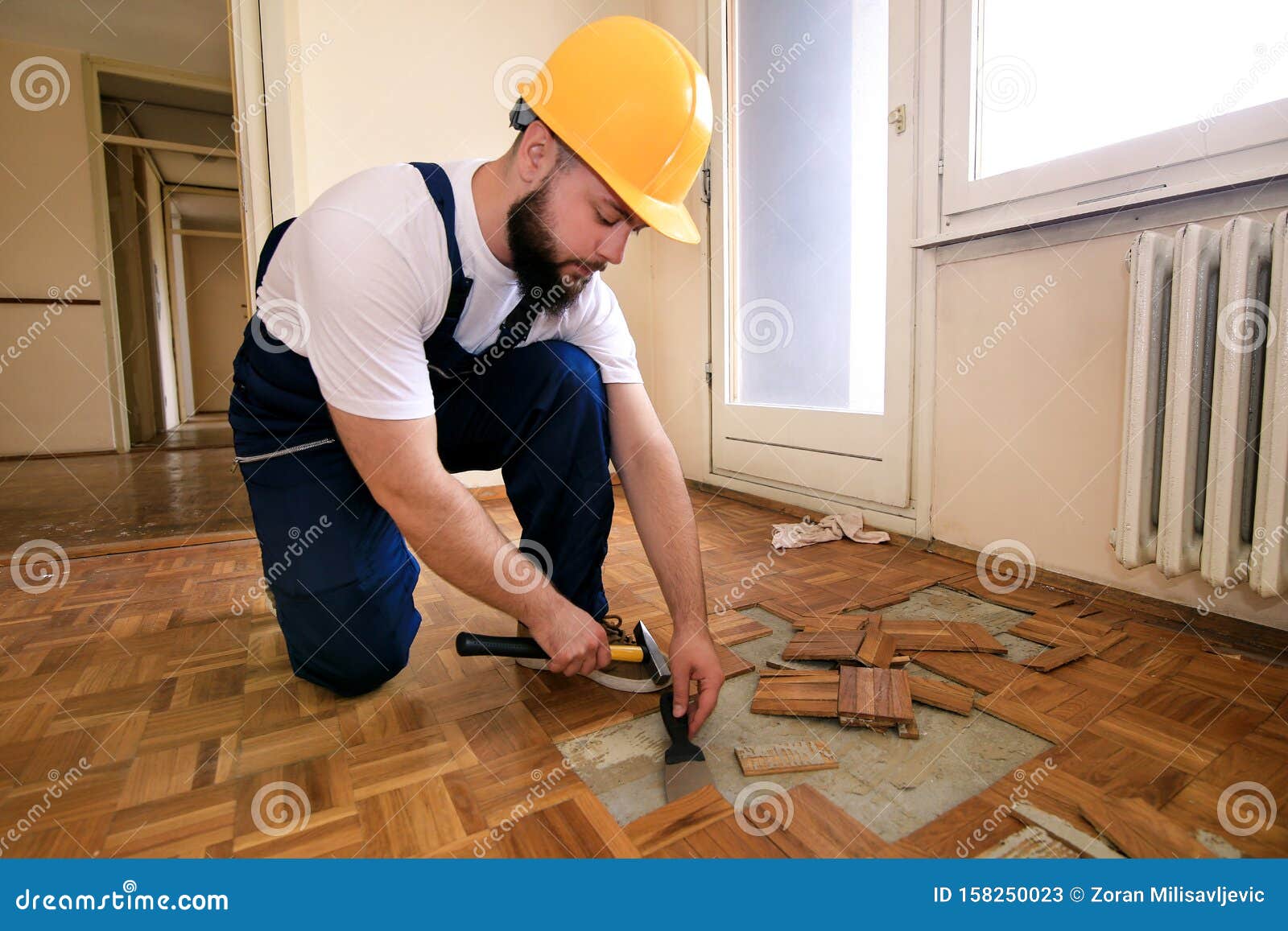 Construction Worker and Handyman is Removing Old Wooden Parquet ...