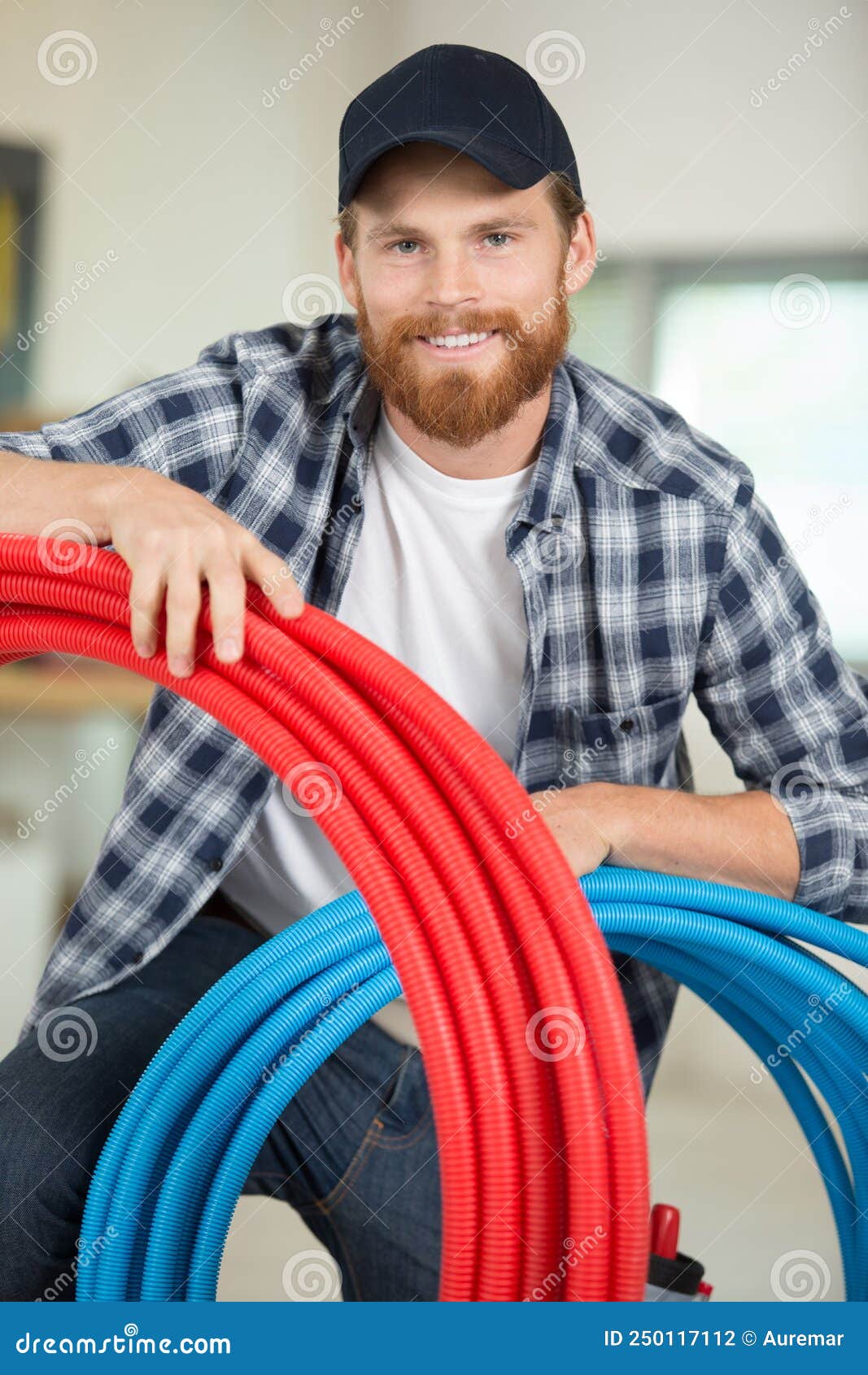 Construction Worker Happily Holding Pipes Stock Photo - Image of ...
