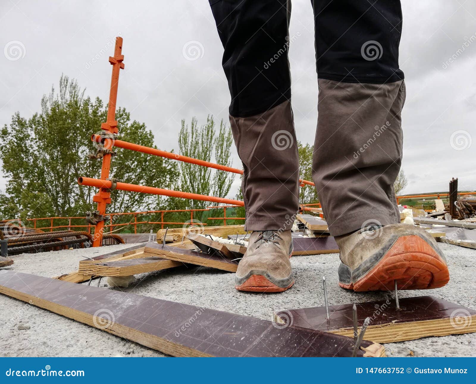 A Construction Worker Has an Accident while Walks through a Site with ...
