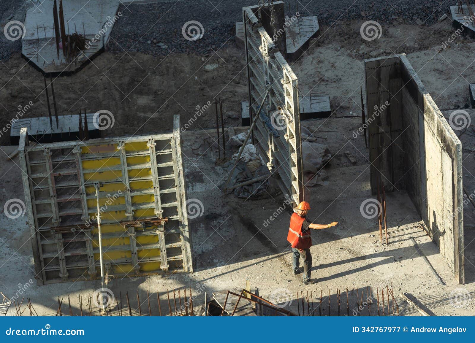 Construction Worker in High Visibility Clothing Operating Tower Crane ...