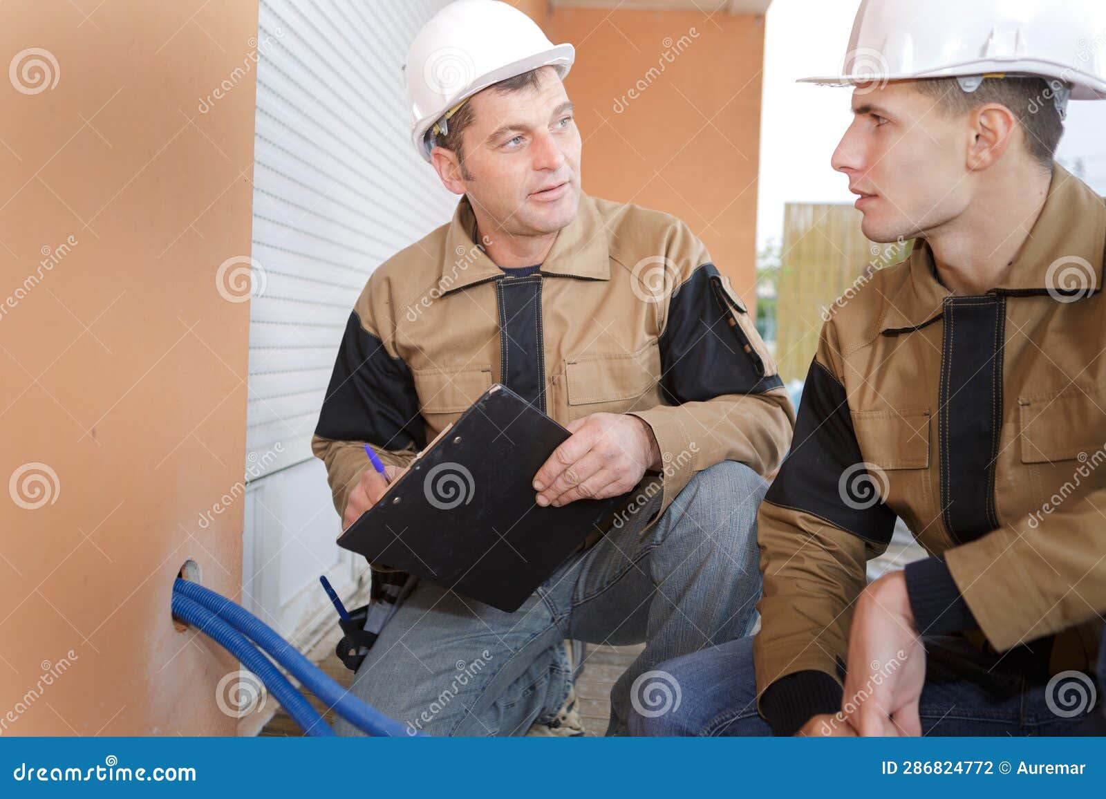Construction Worker and Apprentice Stock Photo - Image of building ...