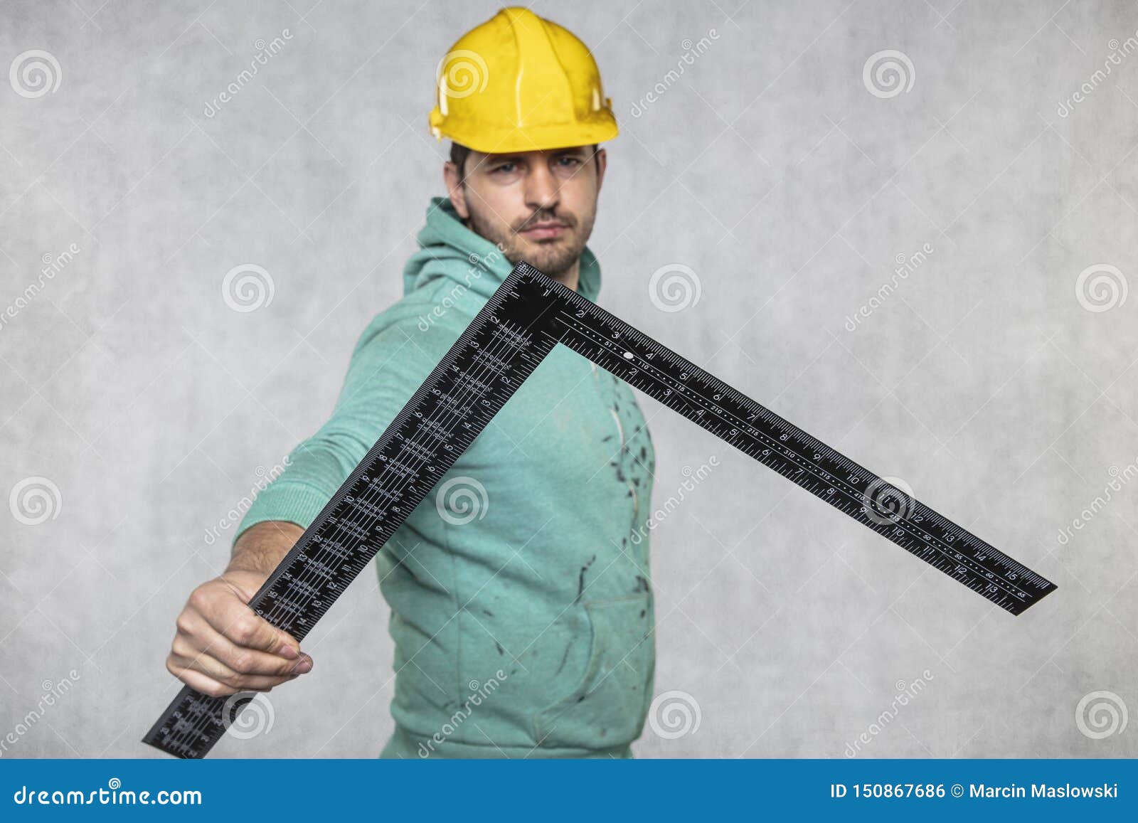 The Construction Worker is Holding a Angle in the Hand, a Guide To ...