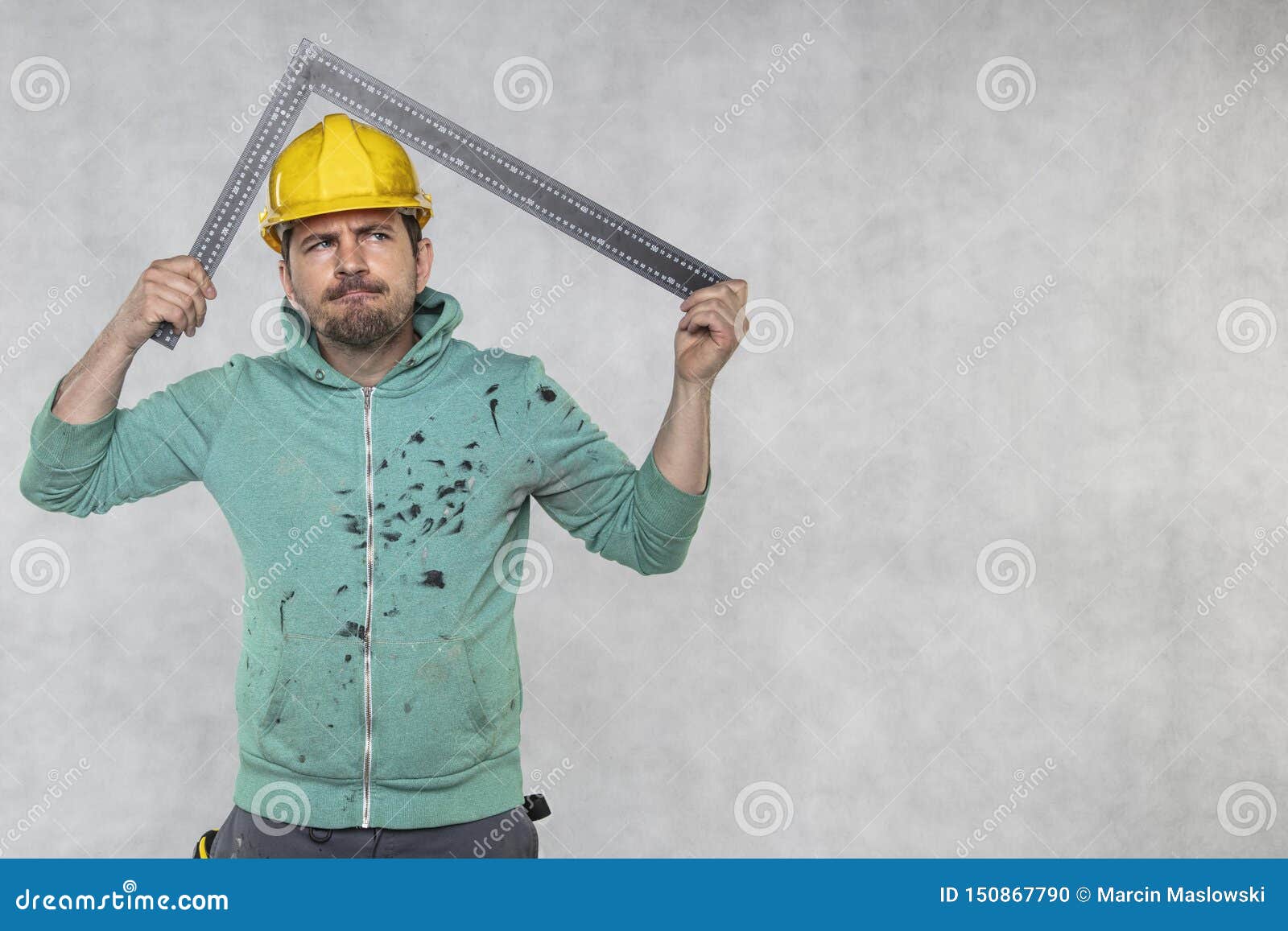 The Construction Worker is Holding a Angle in the Hand, a Guide To ...