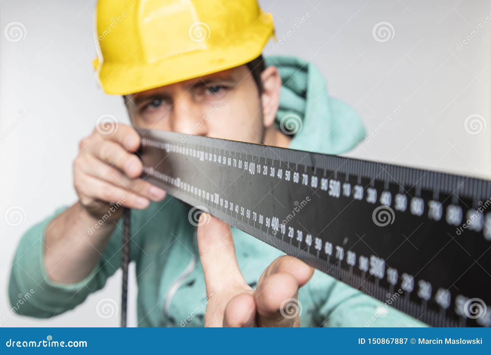 The Construction Worker is Holding a Angle in the Hand, a Guide To ...