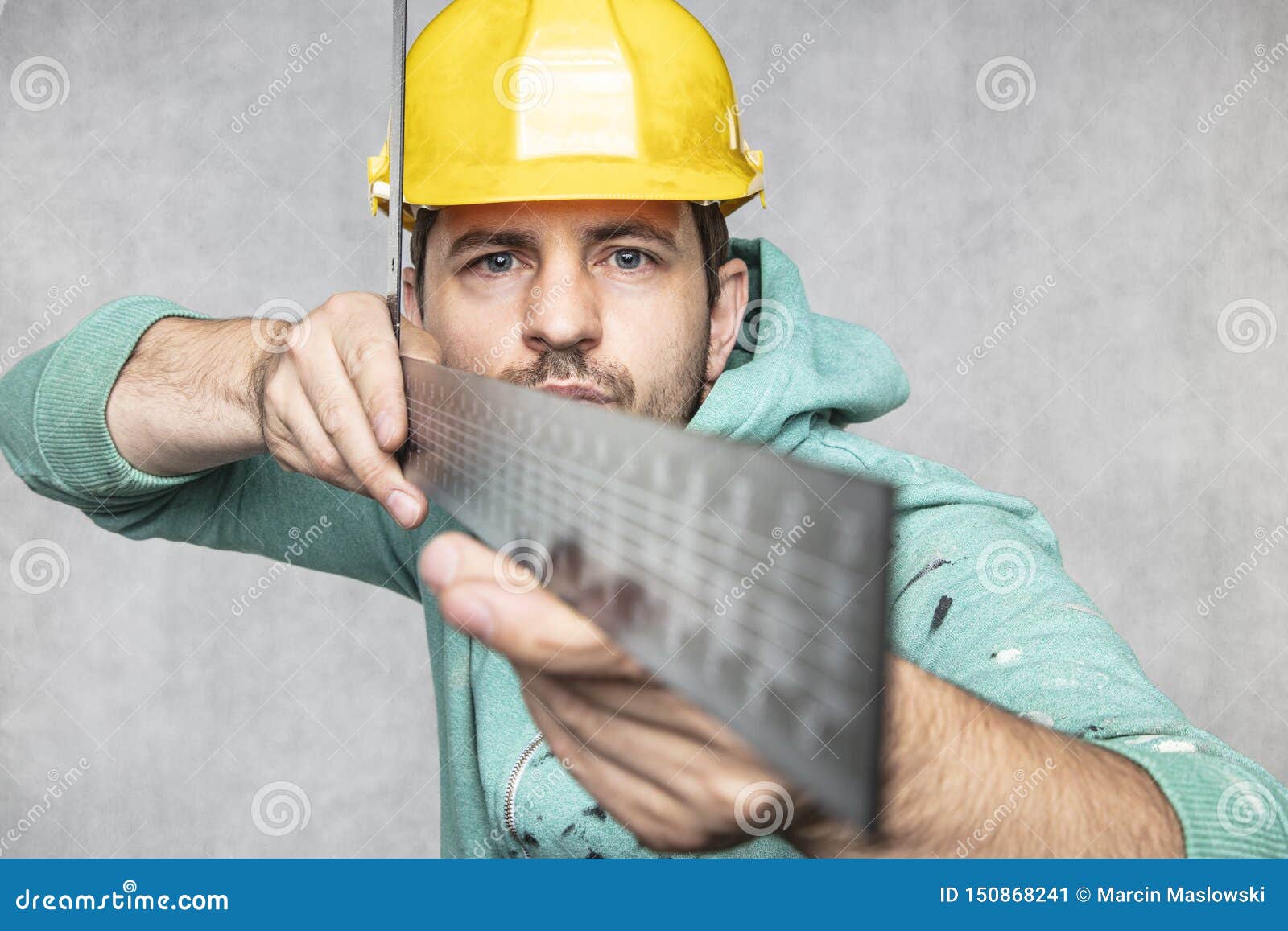 The Construction Worker is Holding a Angle in the Hand, a Guide To ...
