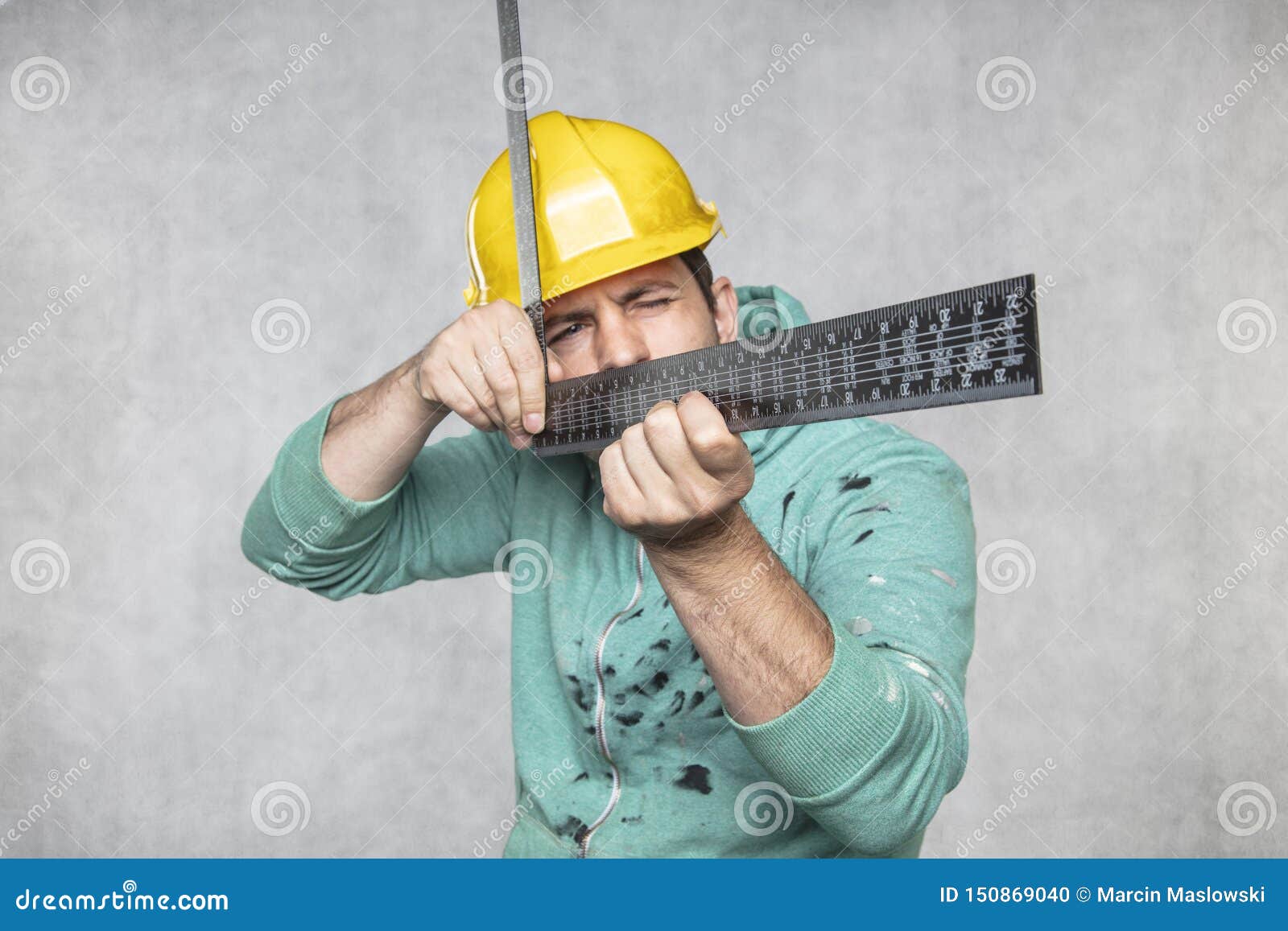 The Construction Worker is Holding a Angle in the Hand, a Guide To ...
