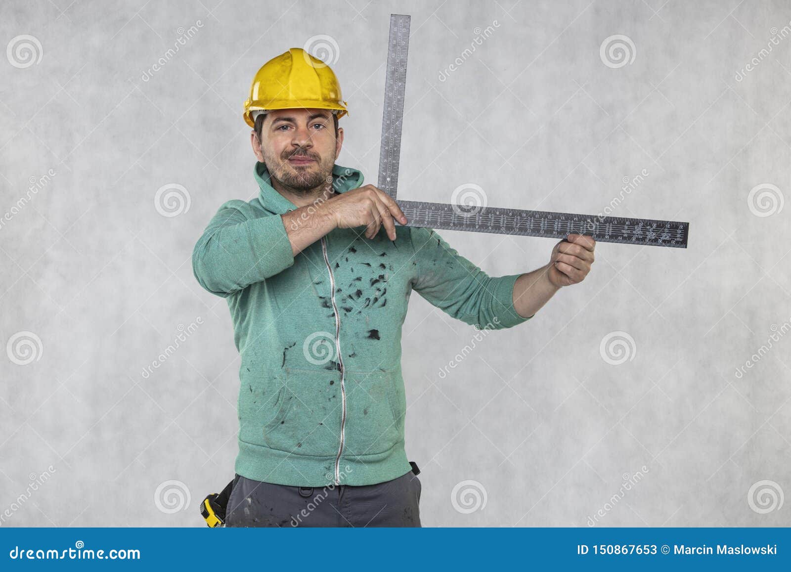 The Construction Worker is Holding a Angle in the Hand, a Guide To ...