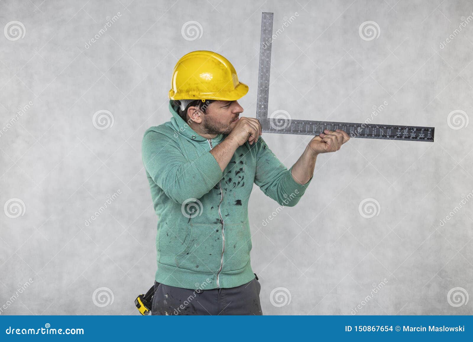 The Construction Worker is Holding a Angle in the Hand, a Guide To ...