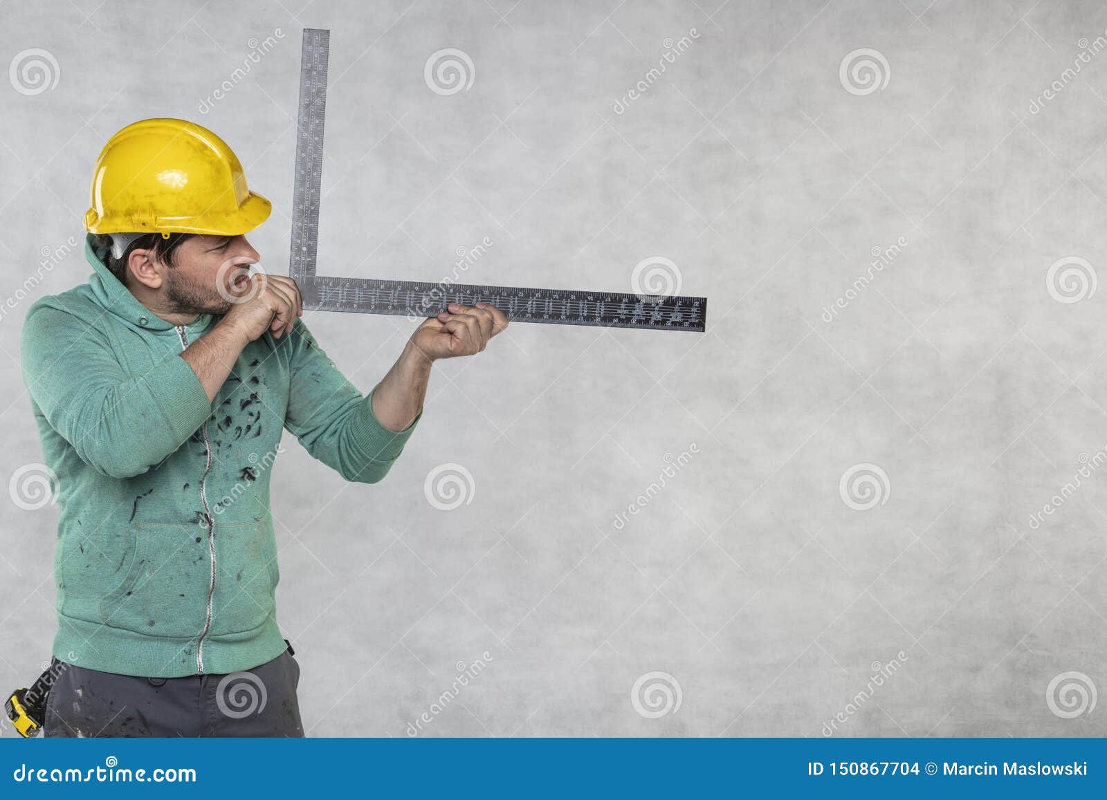 The Construction Worker is Holding a Angle in the Hand, a Guide To ...