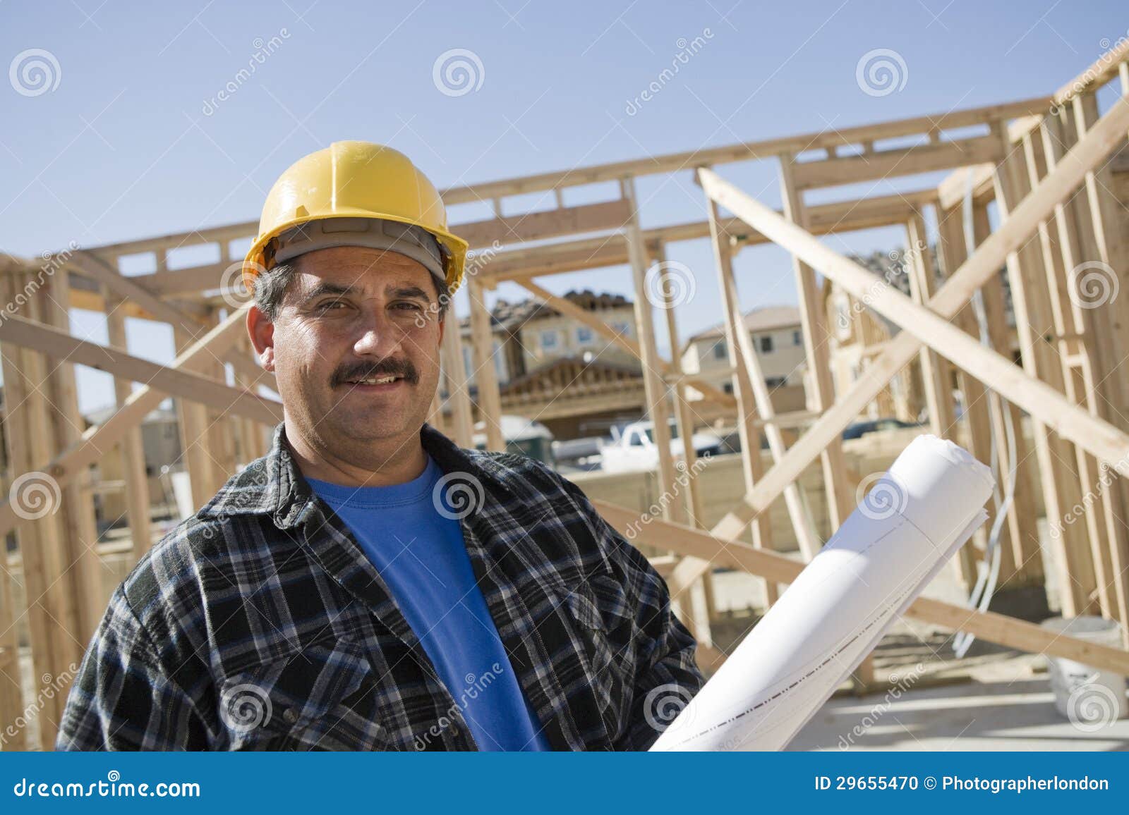 Construction Worker Holding Blueprint Stock Photo - Image of ethnicity ...