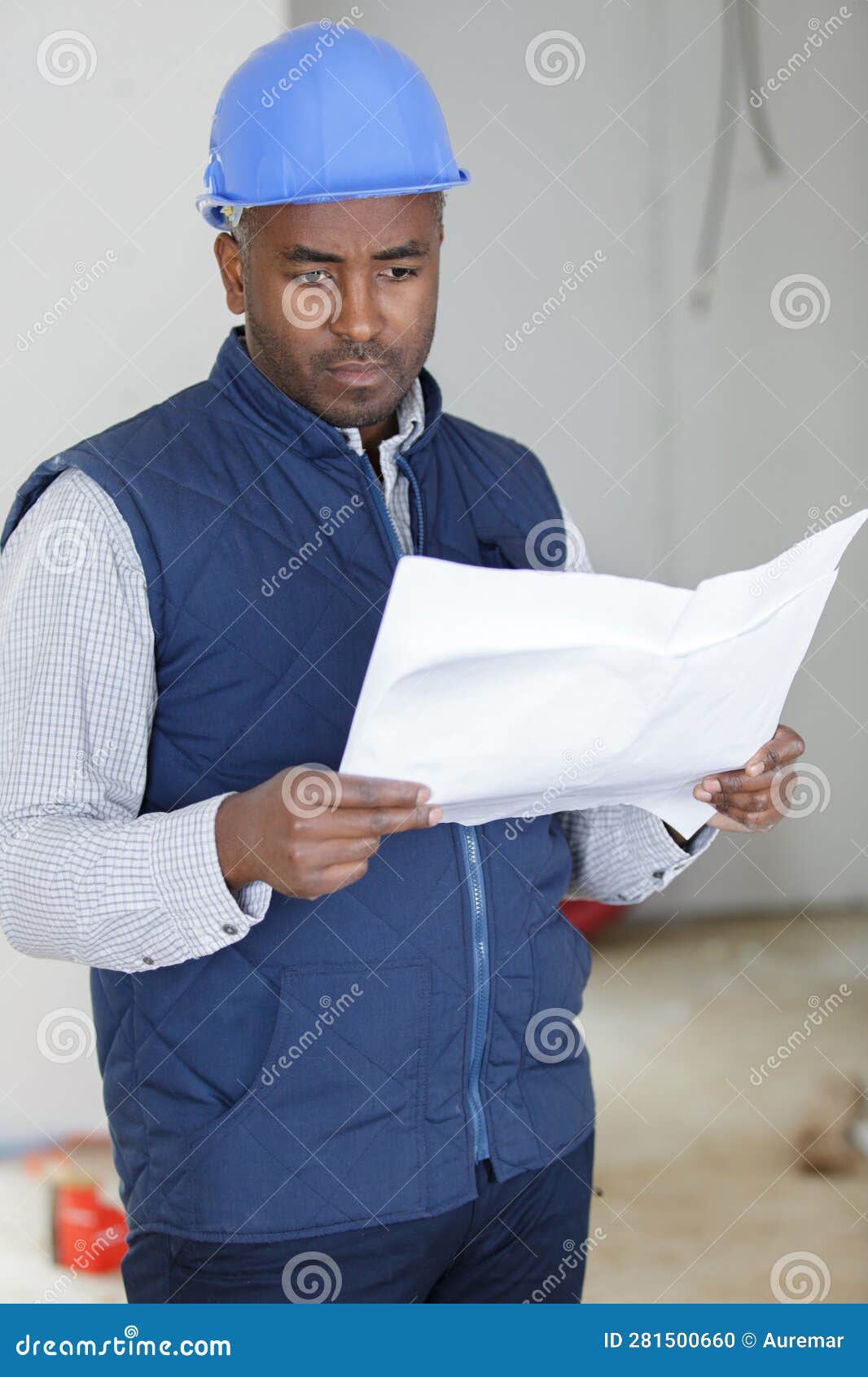 Construction Worker Holding Plan Stock Photo - Image of ...