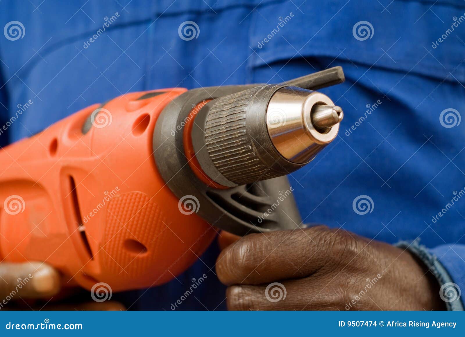 Construction Worker Holding a Power Tool Stock Photo - Image of ...