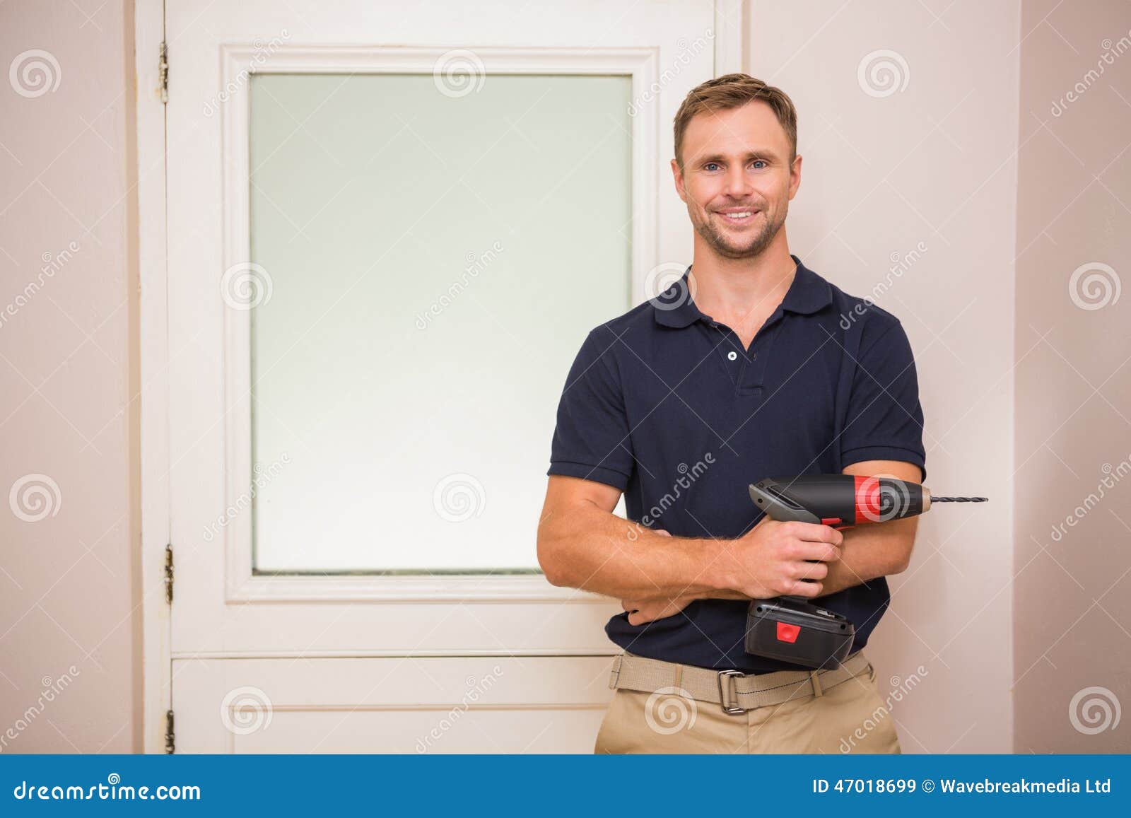 Construction Worker Holding Power Tool with Arms Crossed Stock Image ...