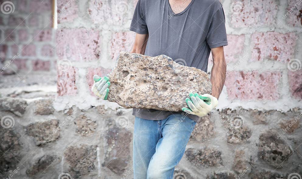 Construction Worker Holding a Quartz Stone Stock Photo - Image of ...