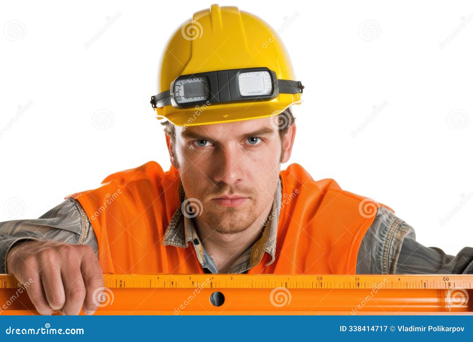 A Construction Worker Holding a Ruler on Site Stock Image - Image of ...