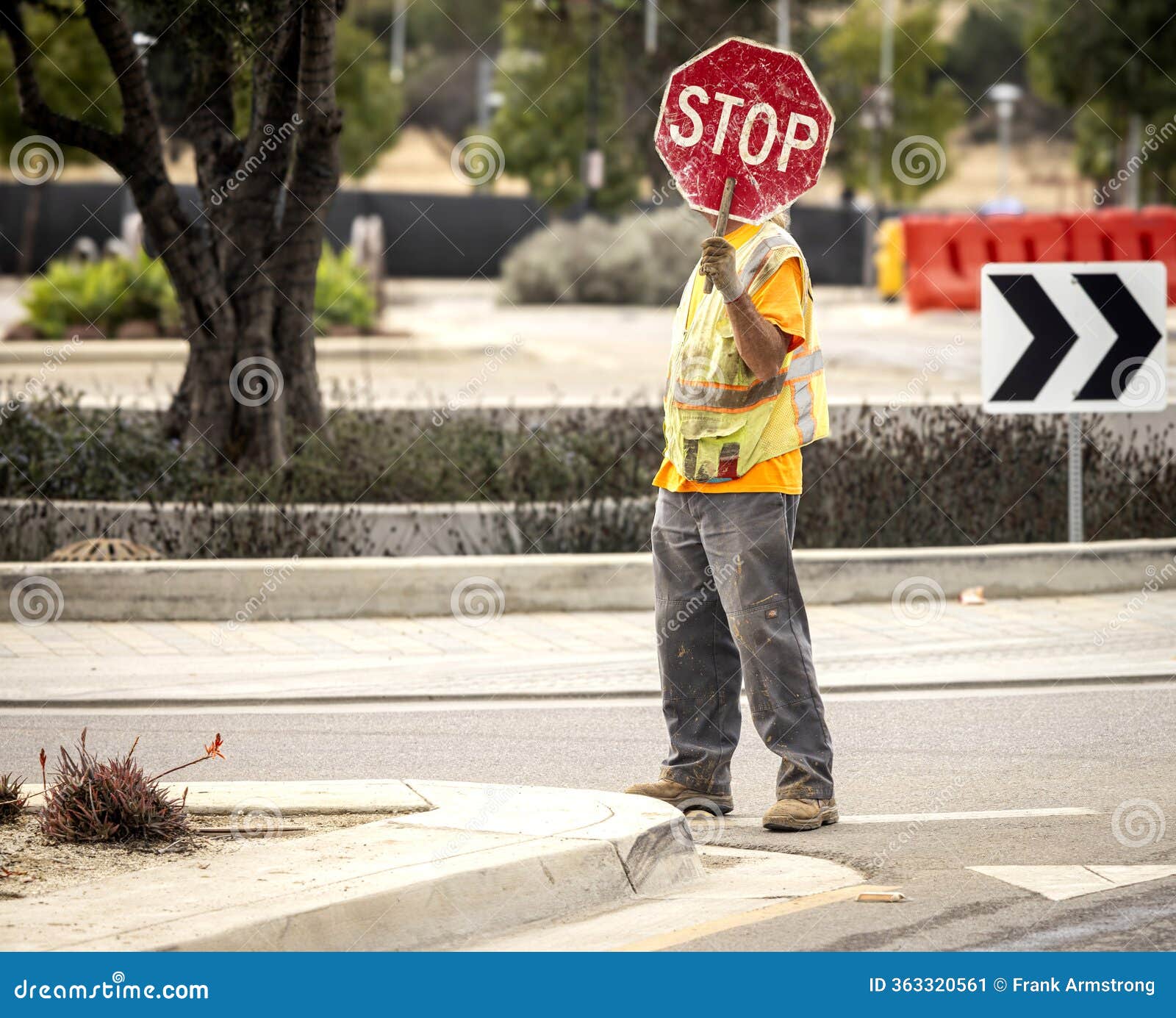 A Construction Worker Holding a Stop Sign Blocking His Face Stock Image ...