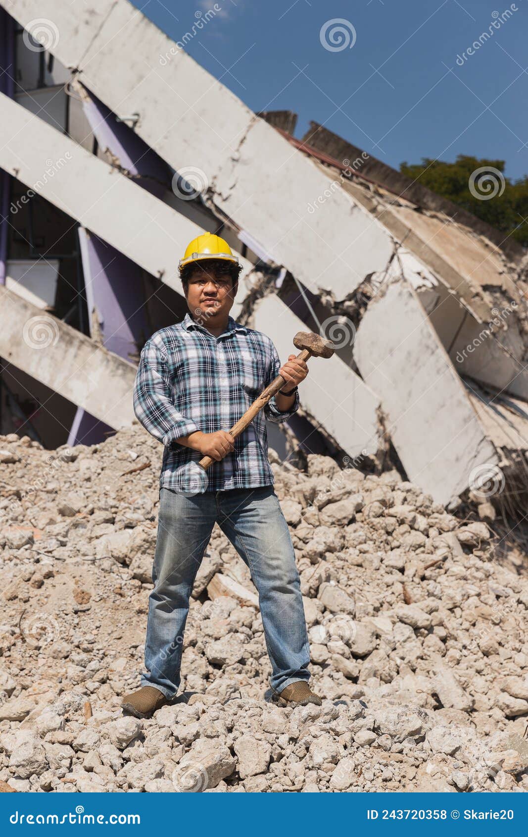 Construction Worker Holding a Sledge Hammer Standing on Demolish ...