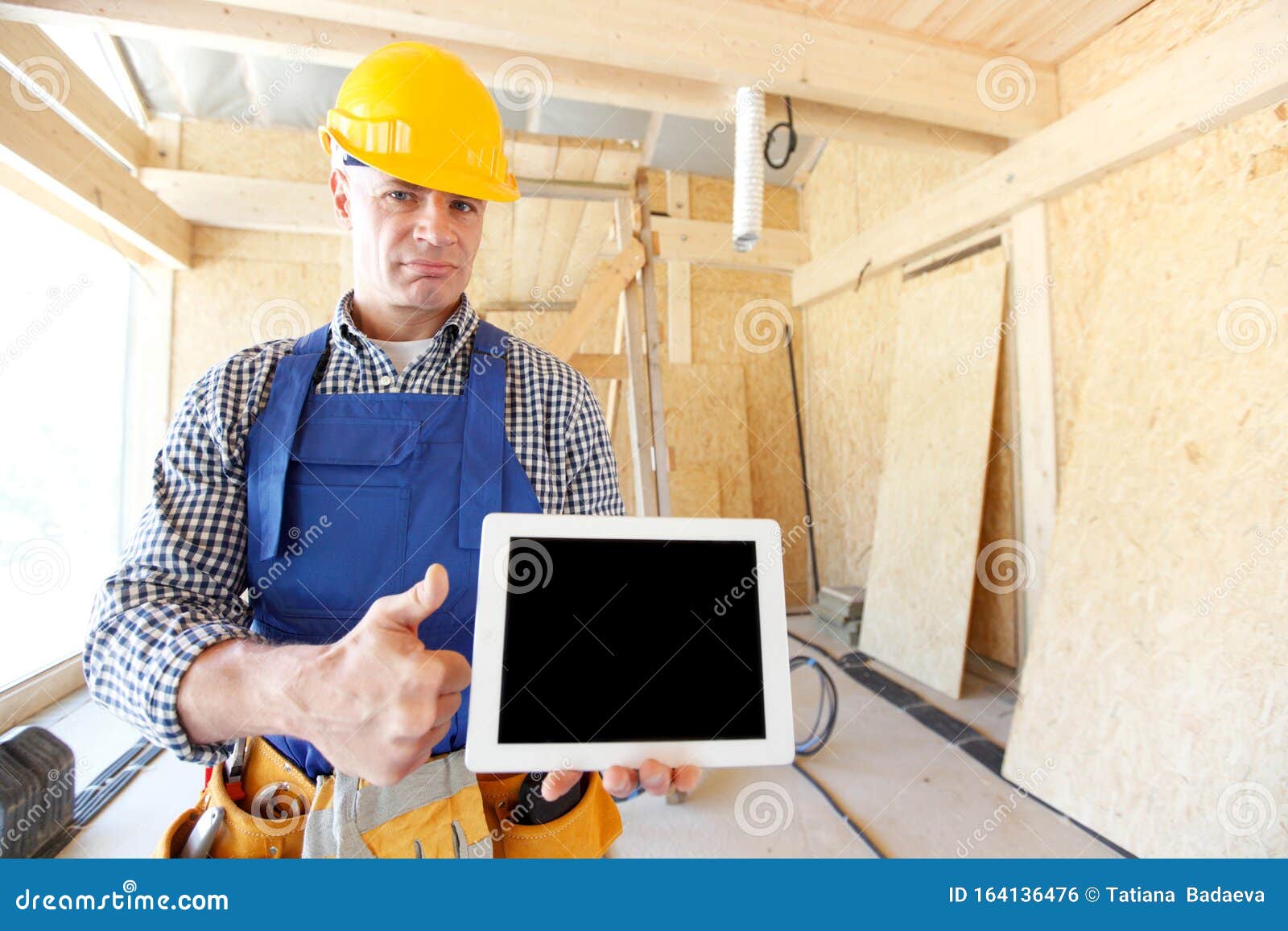 Construction Worker Holding Tablet Stock Photo - Image of blank ...