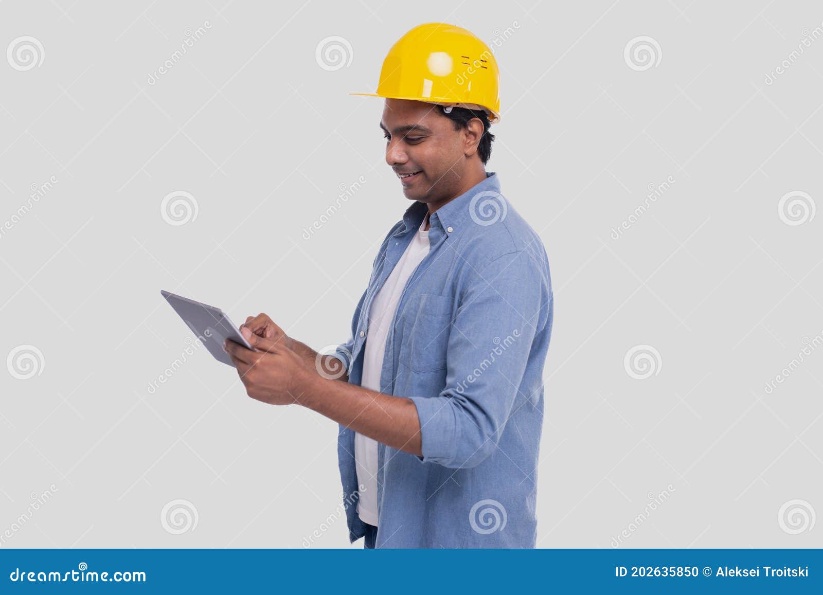 Construction Worker Holding Tablet in Hands. Man Using Tablet ...